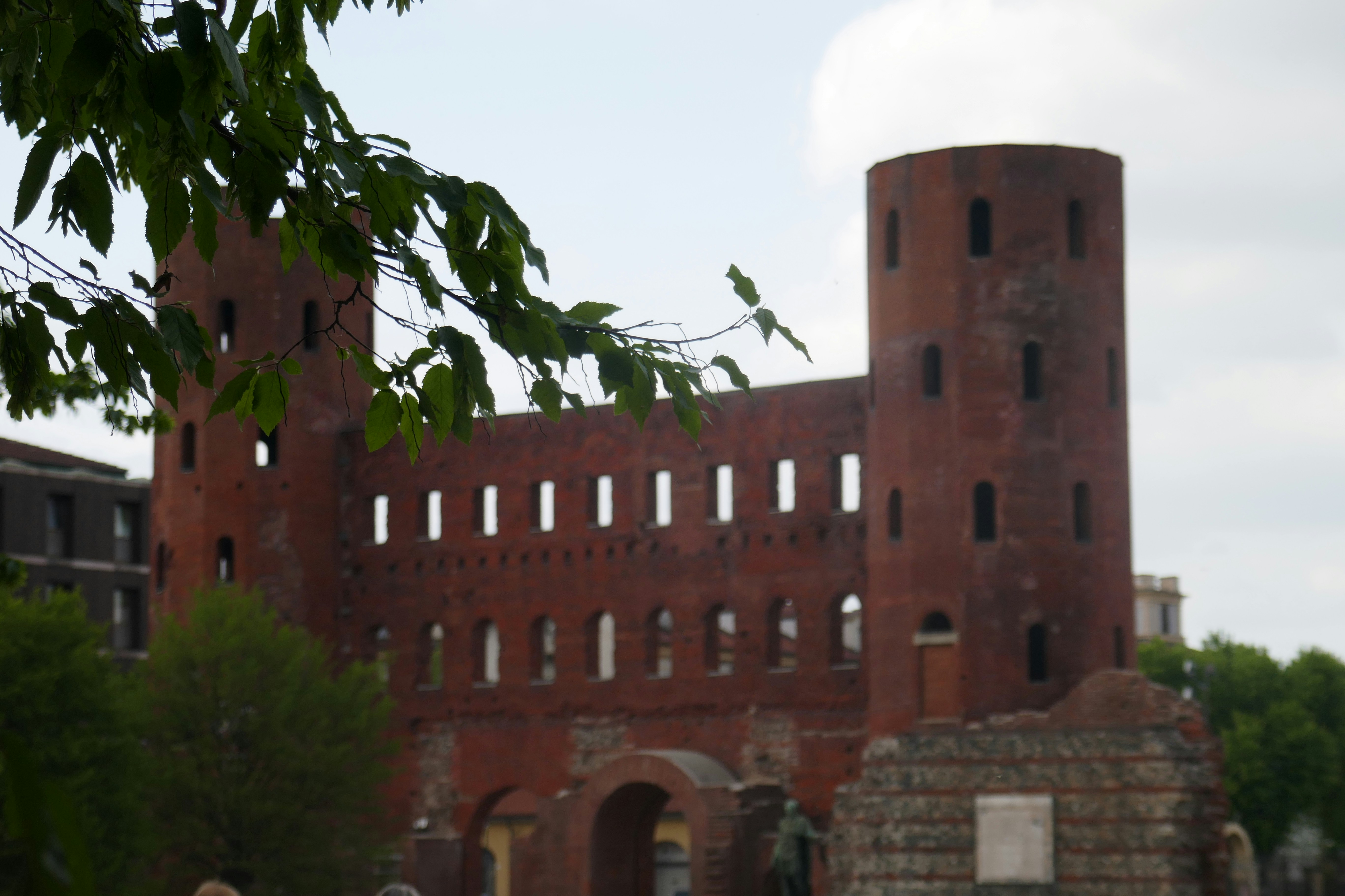 Ruined Brick Fortress Framed by Overhanging Branches