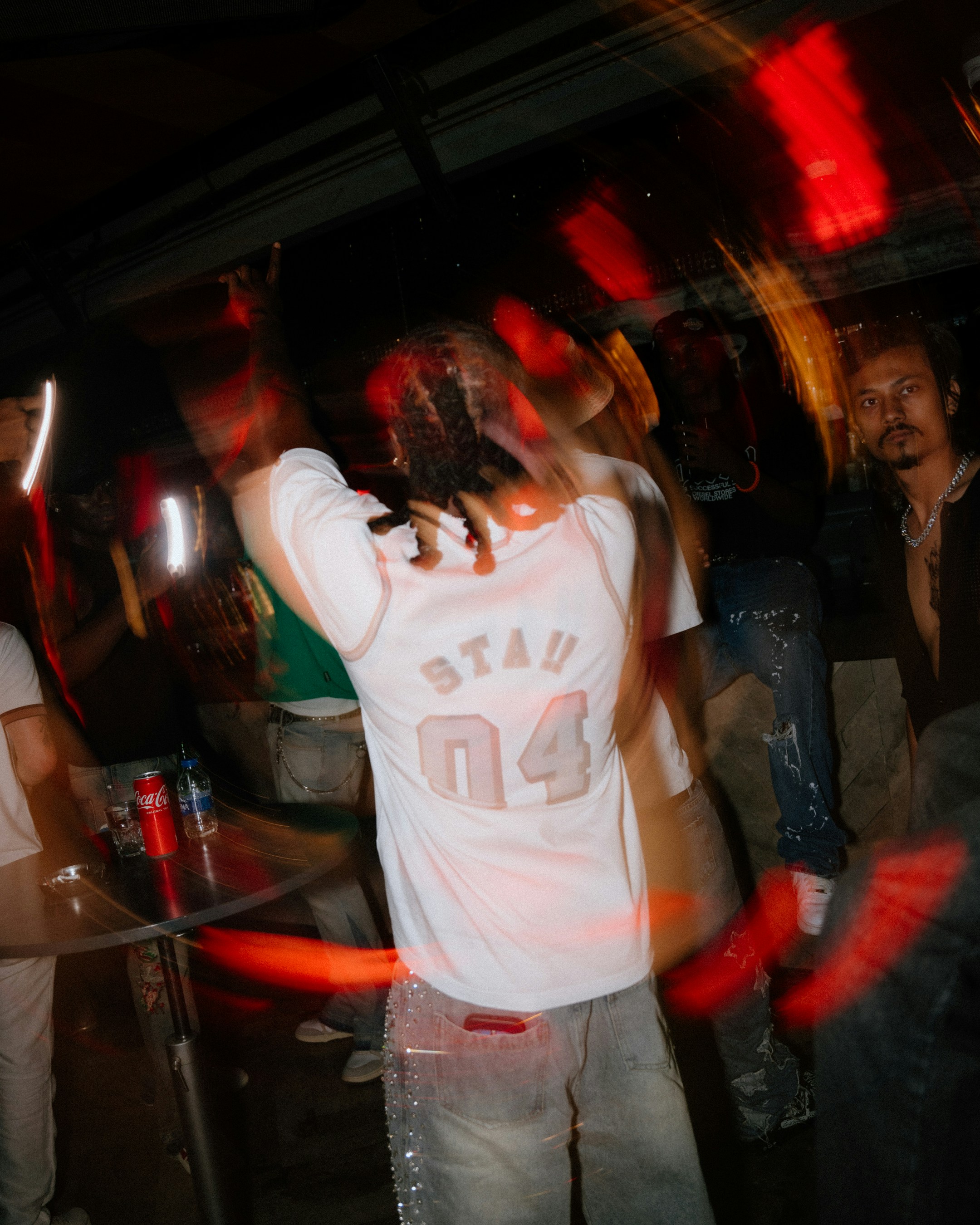 Motion in the Night: Red Lights and Moving Faces at the Club
