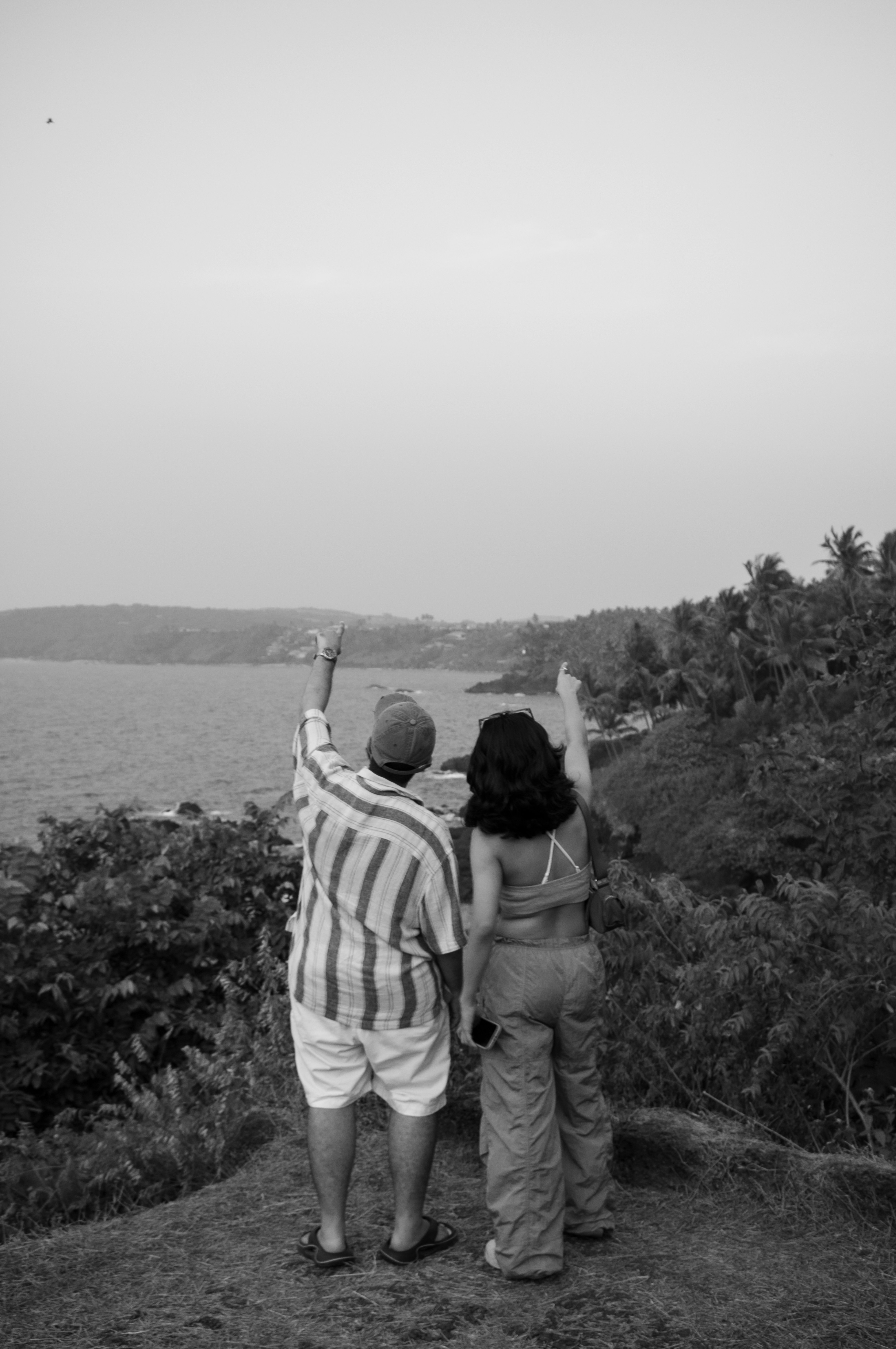 Couple at the Edge: A Shared Gesture Toward the Horizon