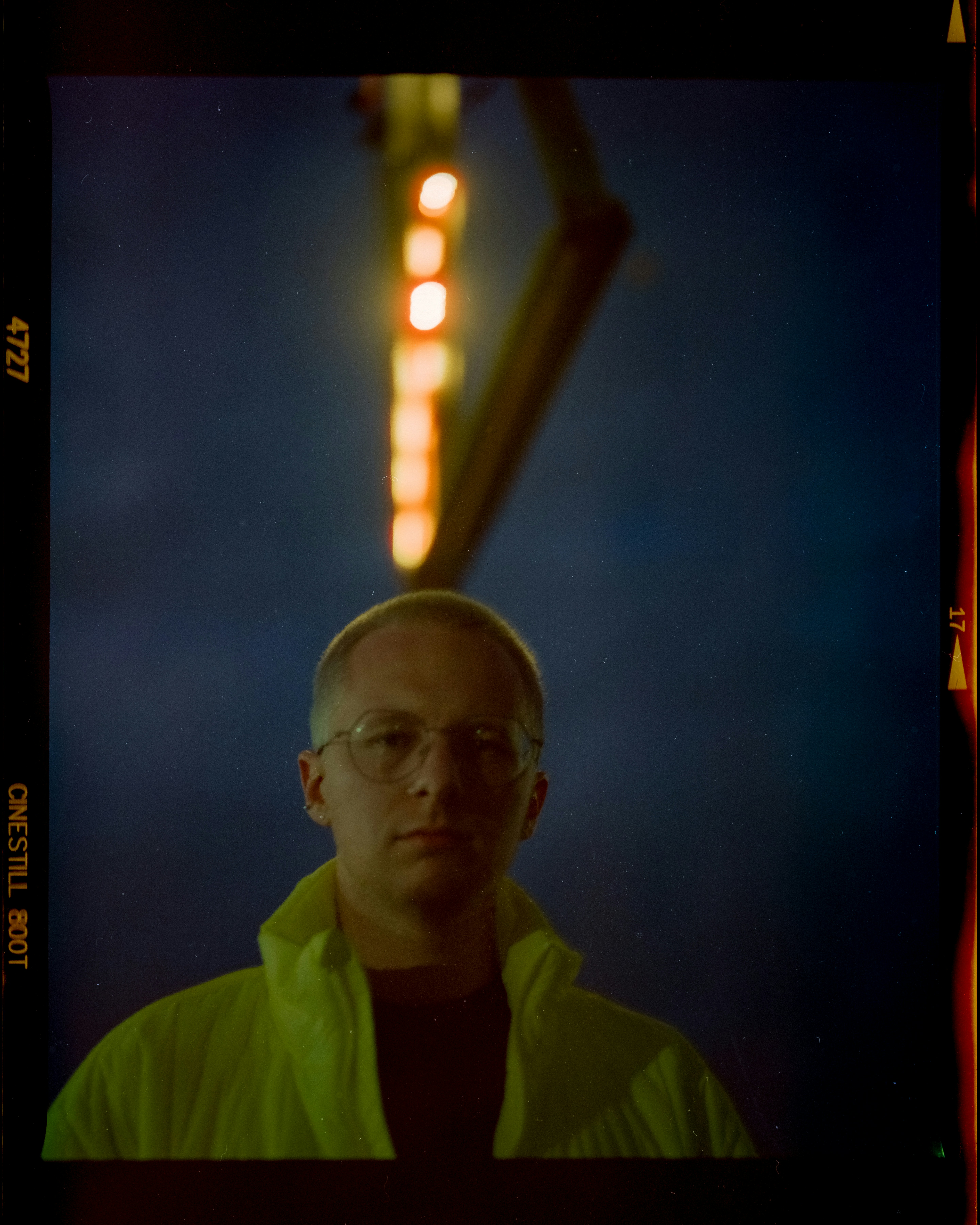 Neon Evening Portrait Under a Distant Ferris Wheel Glow