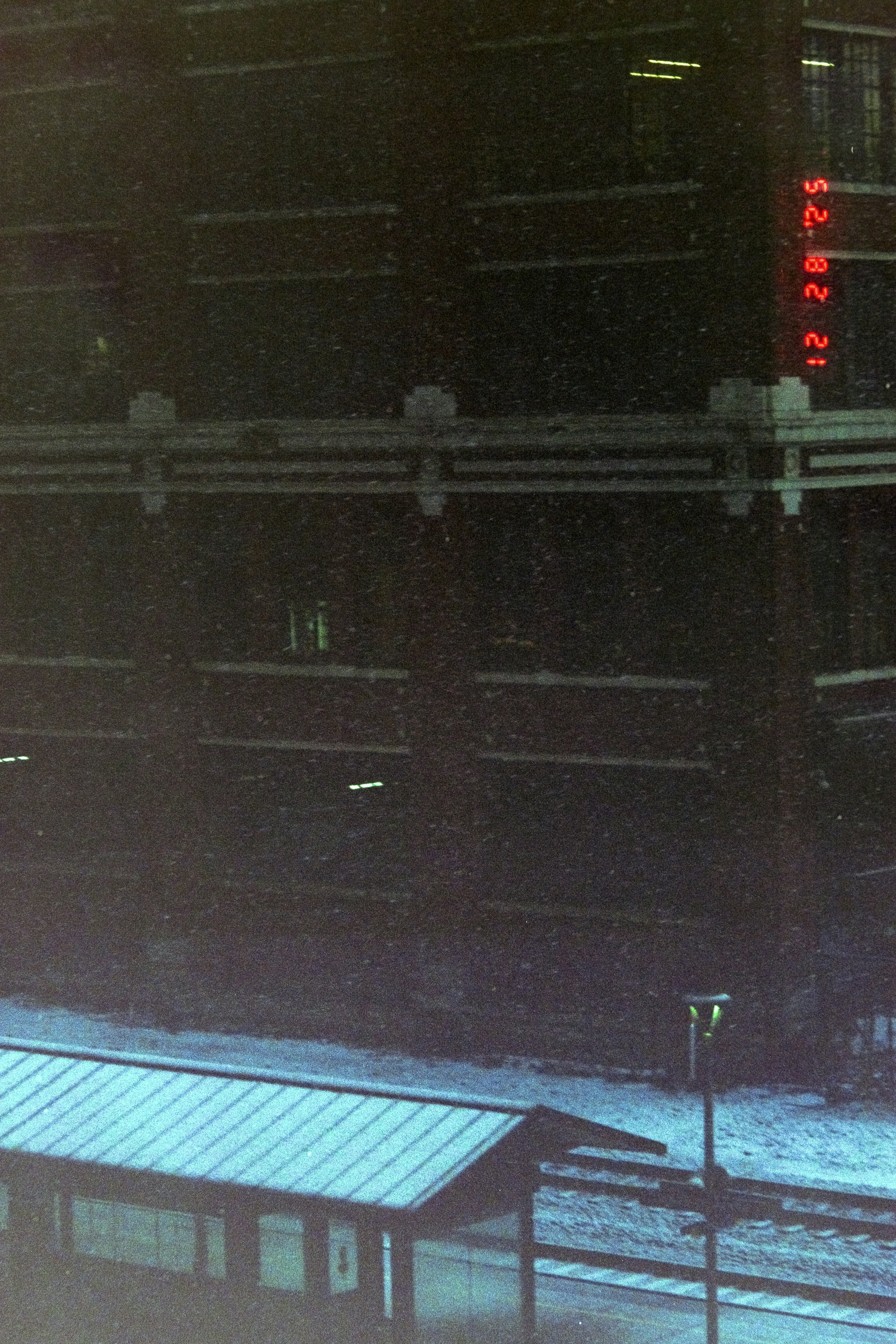 Night Train Reflections: A Quiet Moment by the Platform Edge