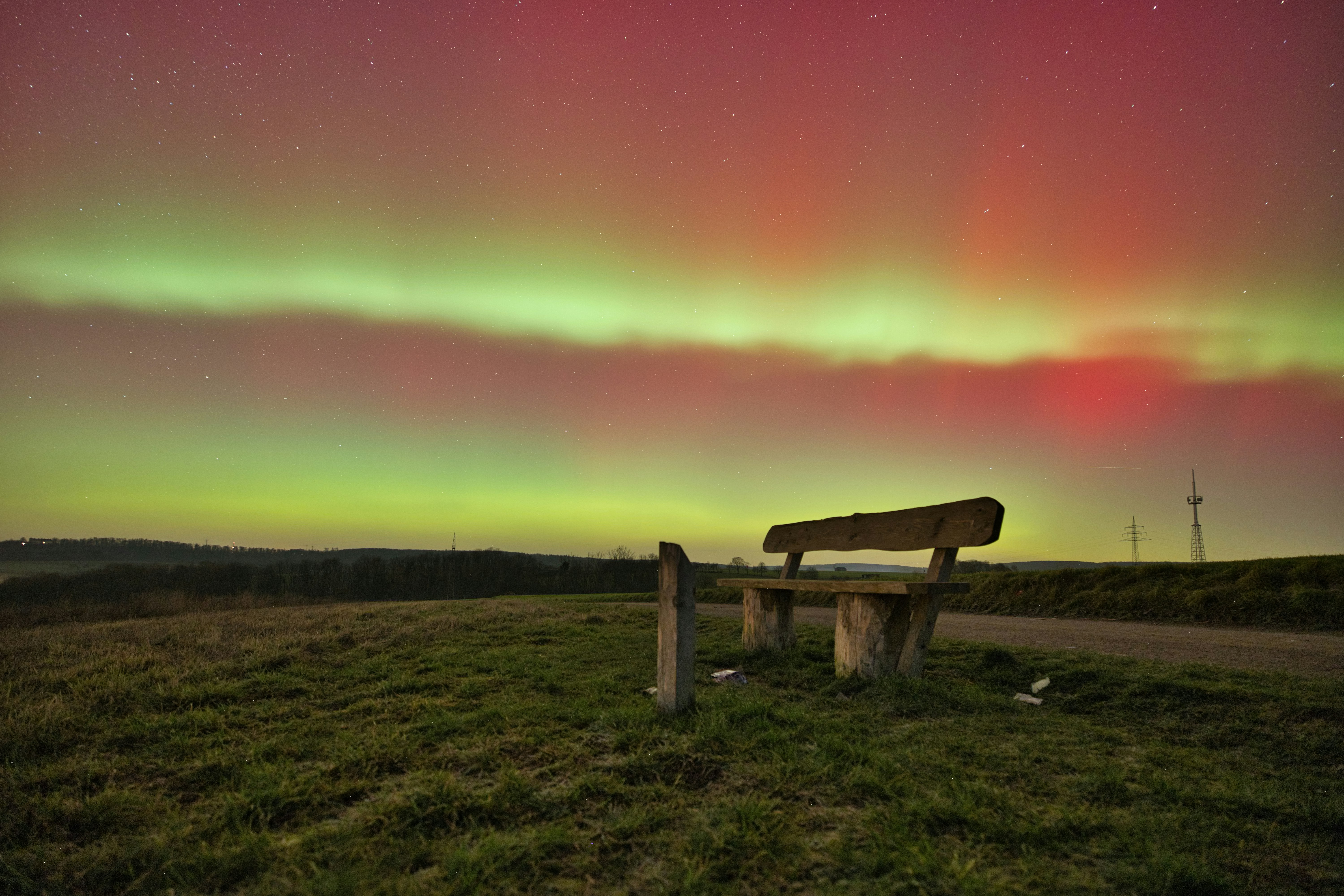 Aurora Bench: Night Sky Draped Over a Quiet Field