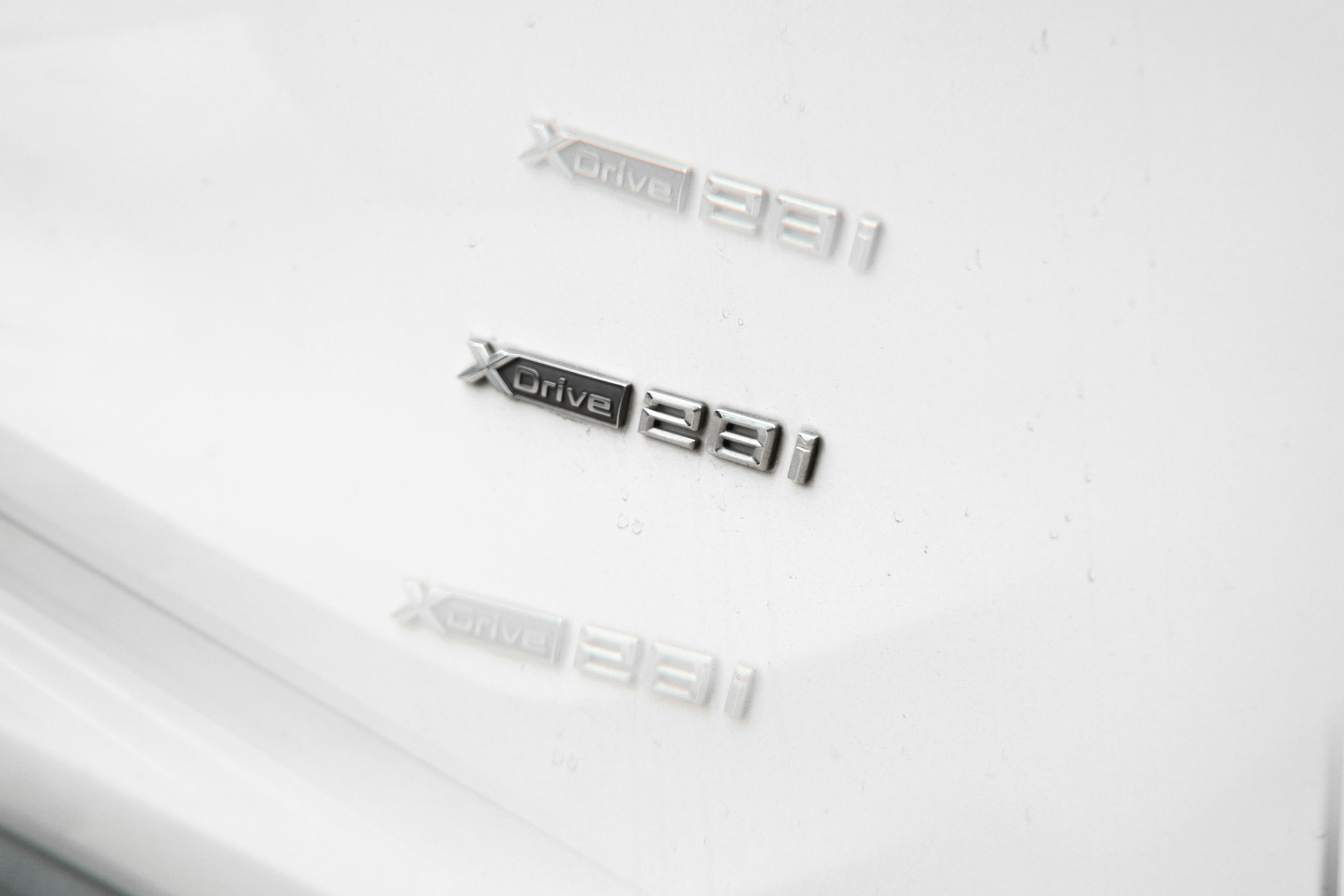 X-Grounded Emblems in Soft Focus White Geometry