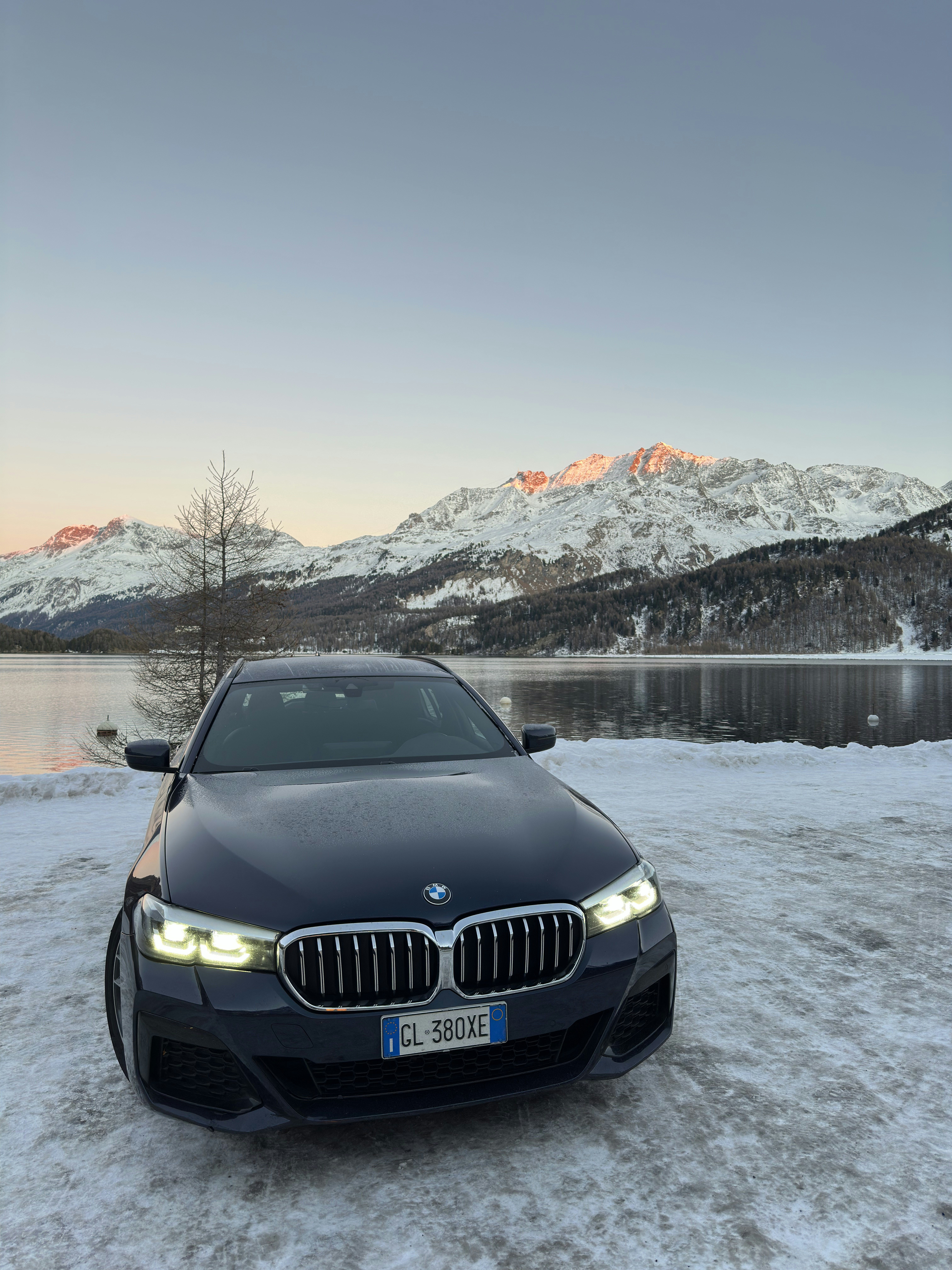 Snowy Lakeside Drive: The BMW at Dusk