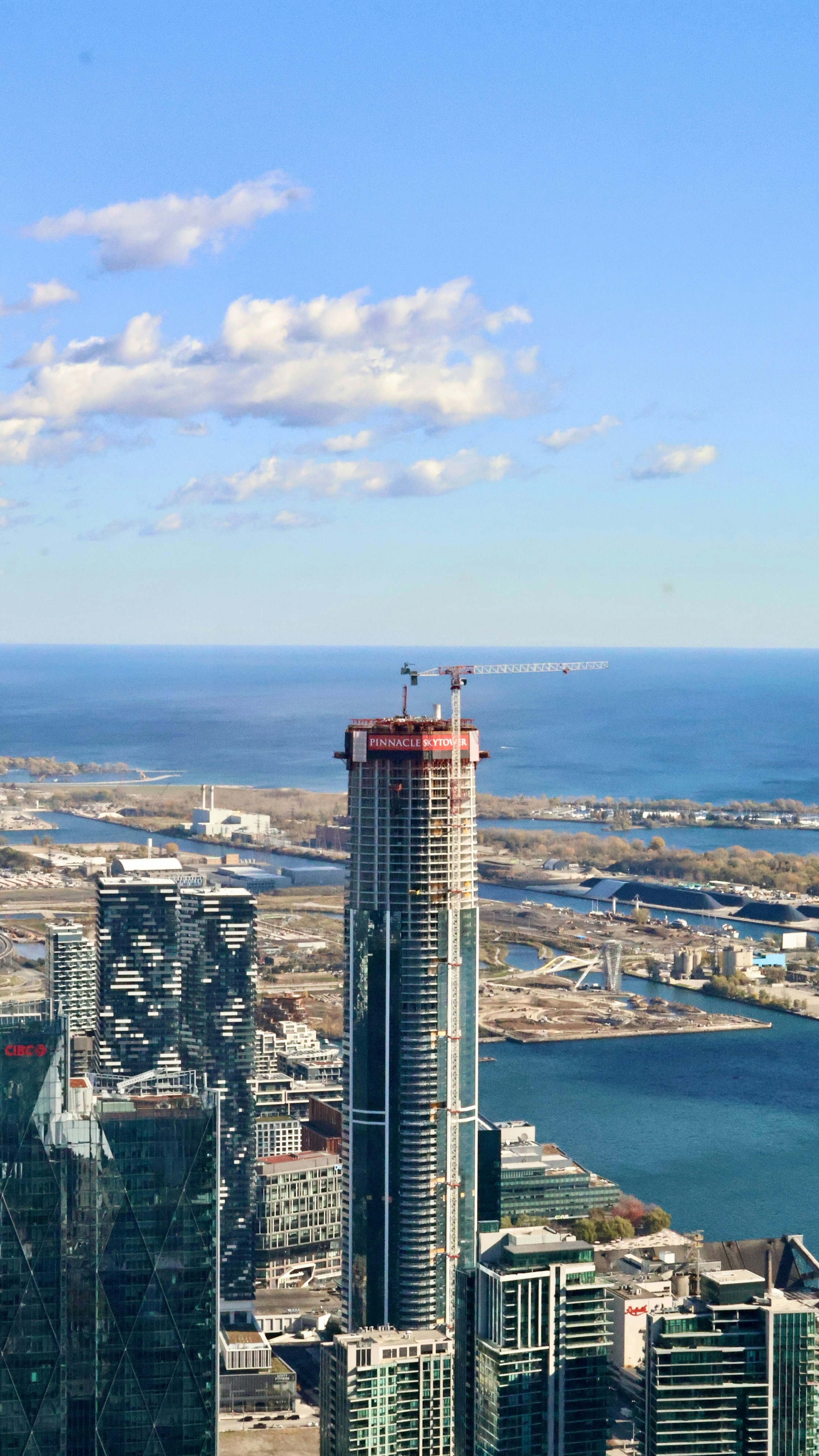 Towering Finite: A Crane Rises Among Blue Horizons
