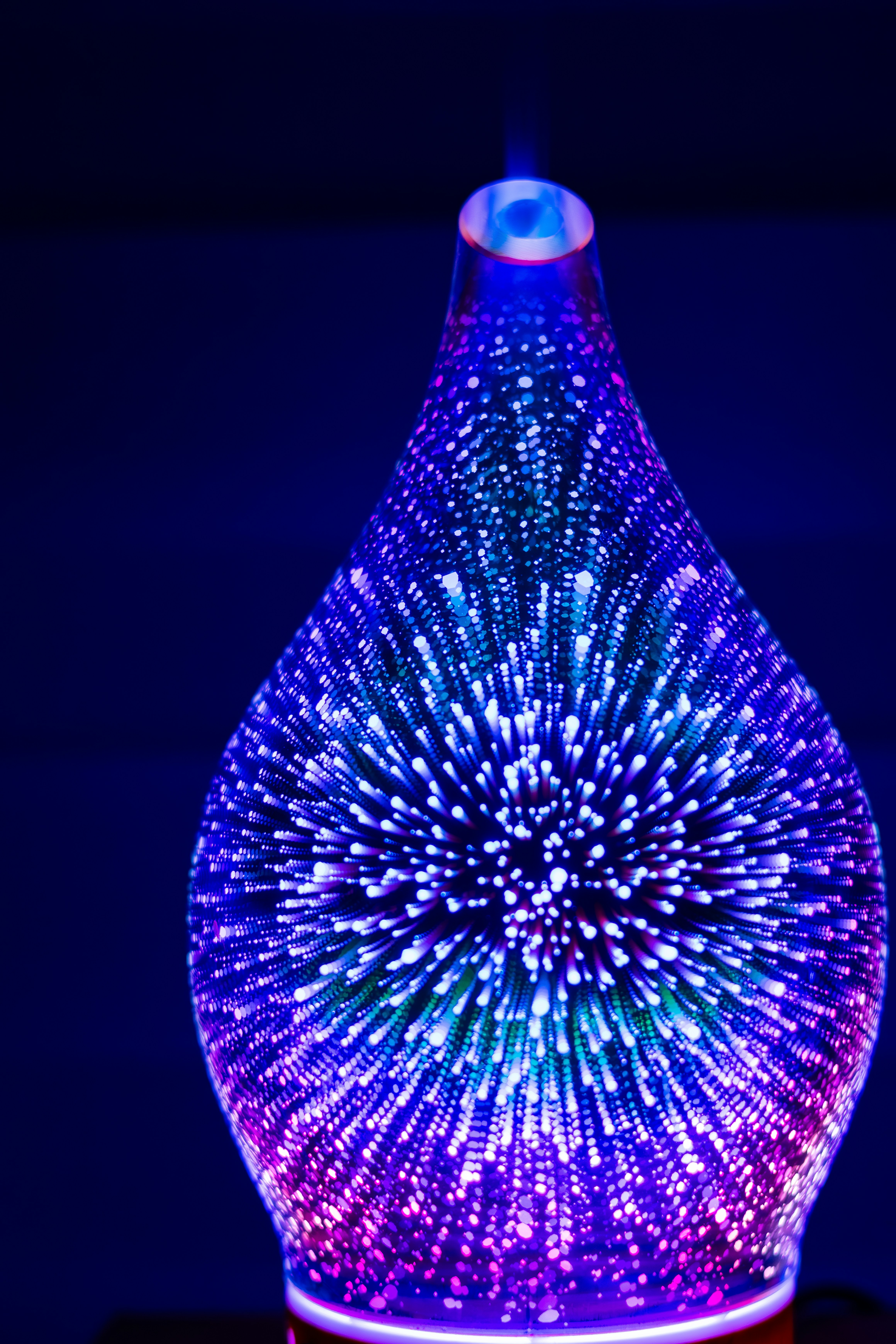 Aurora Bottle: a glowing, spiraling plume of LED confetti