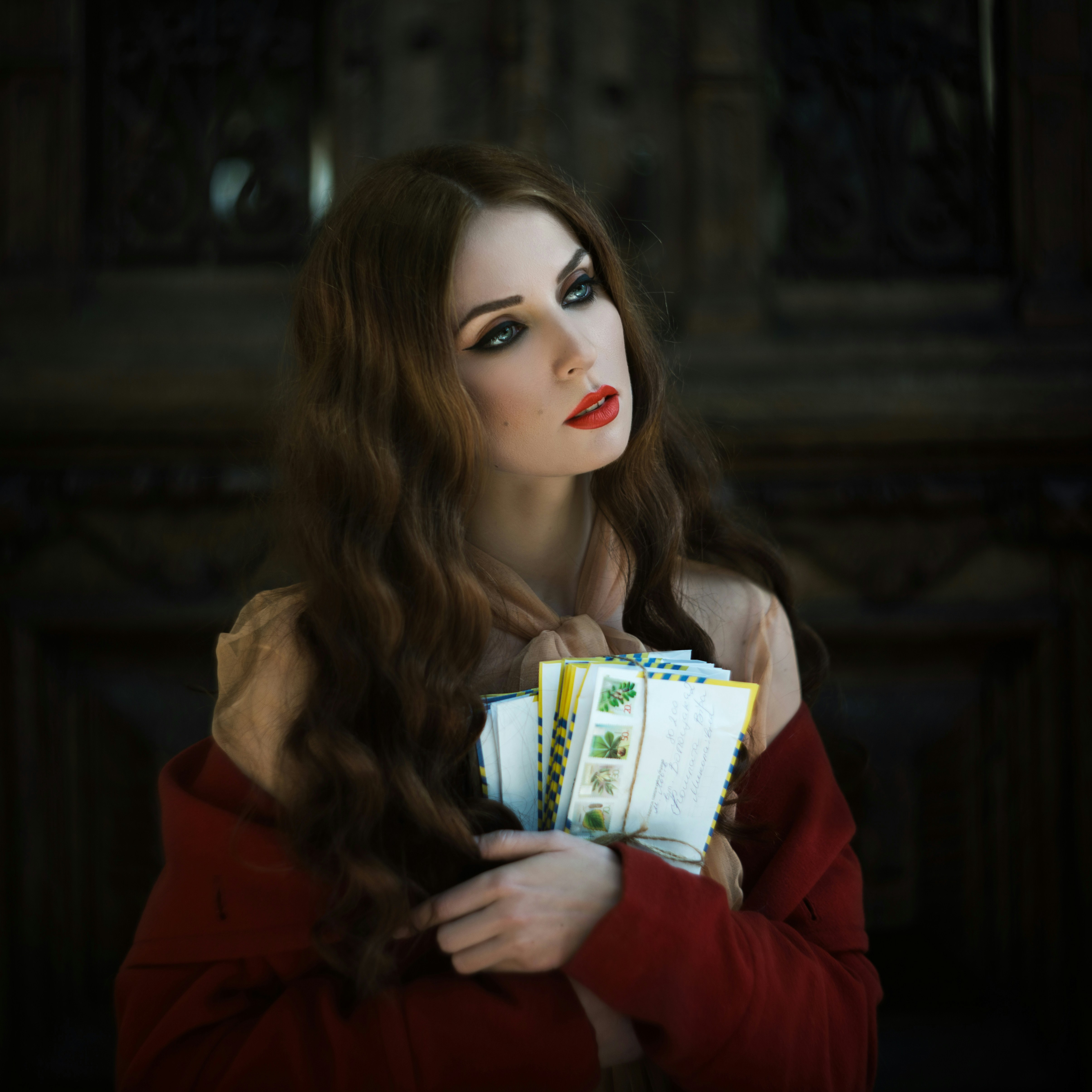 Moonlit Silence: A Woman with Cards in a Velvet Red embraces the Night
