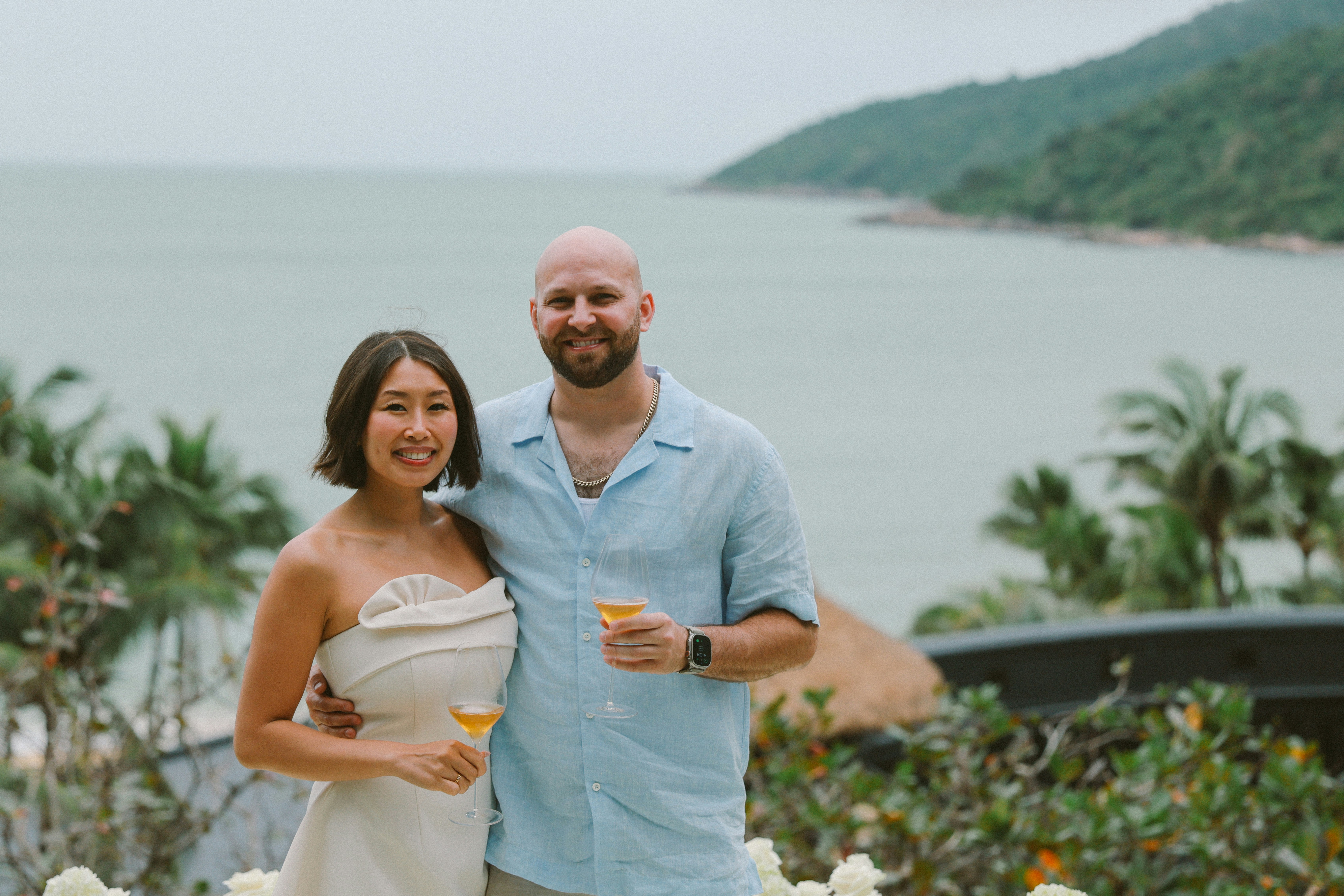 Two Friends in Sunset Toast on a Tropical Balcony