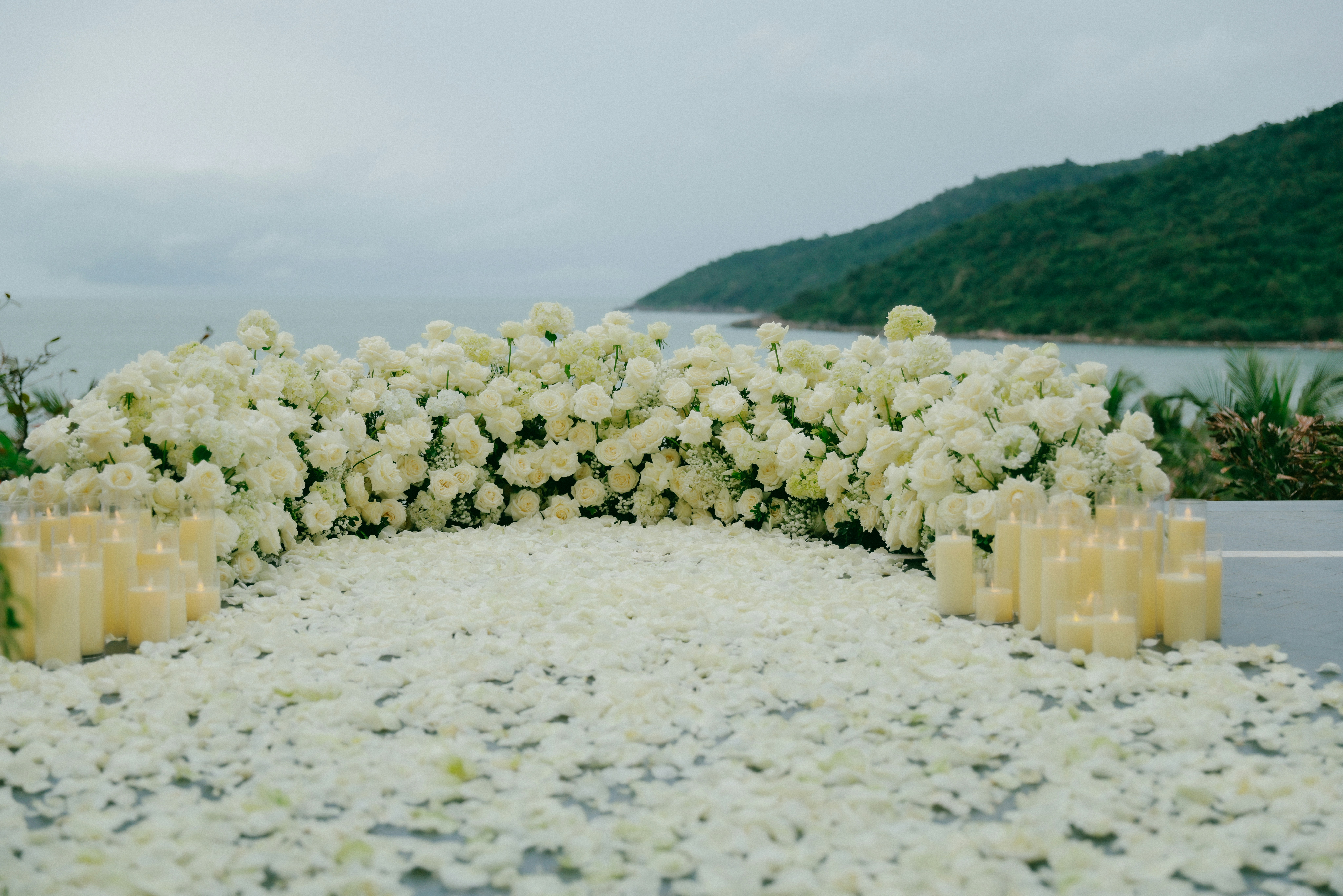 A Sea of Petals: White Floral Aisle by the Shore