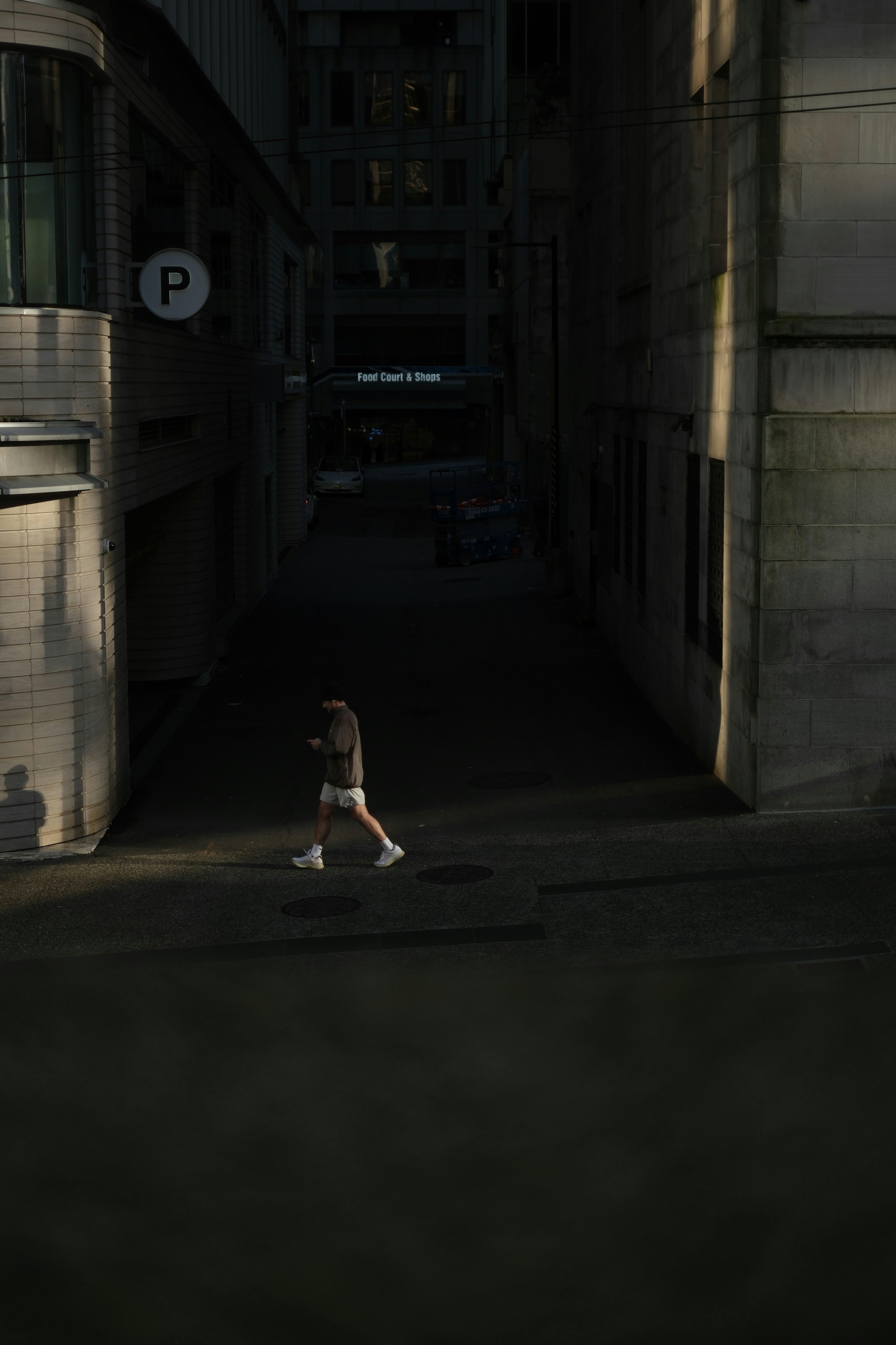Stride Through the Narrow Light: A solitary runner in a sunlit canyon