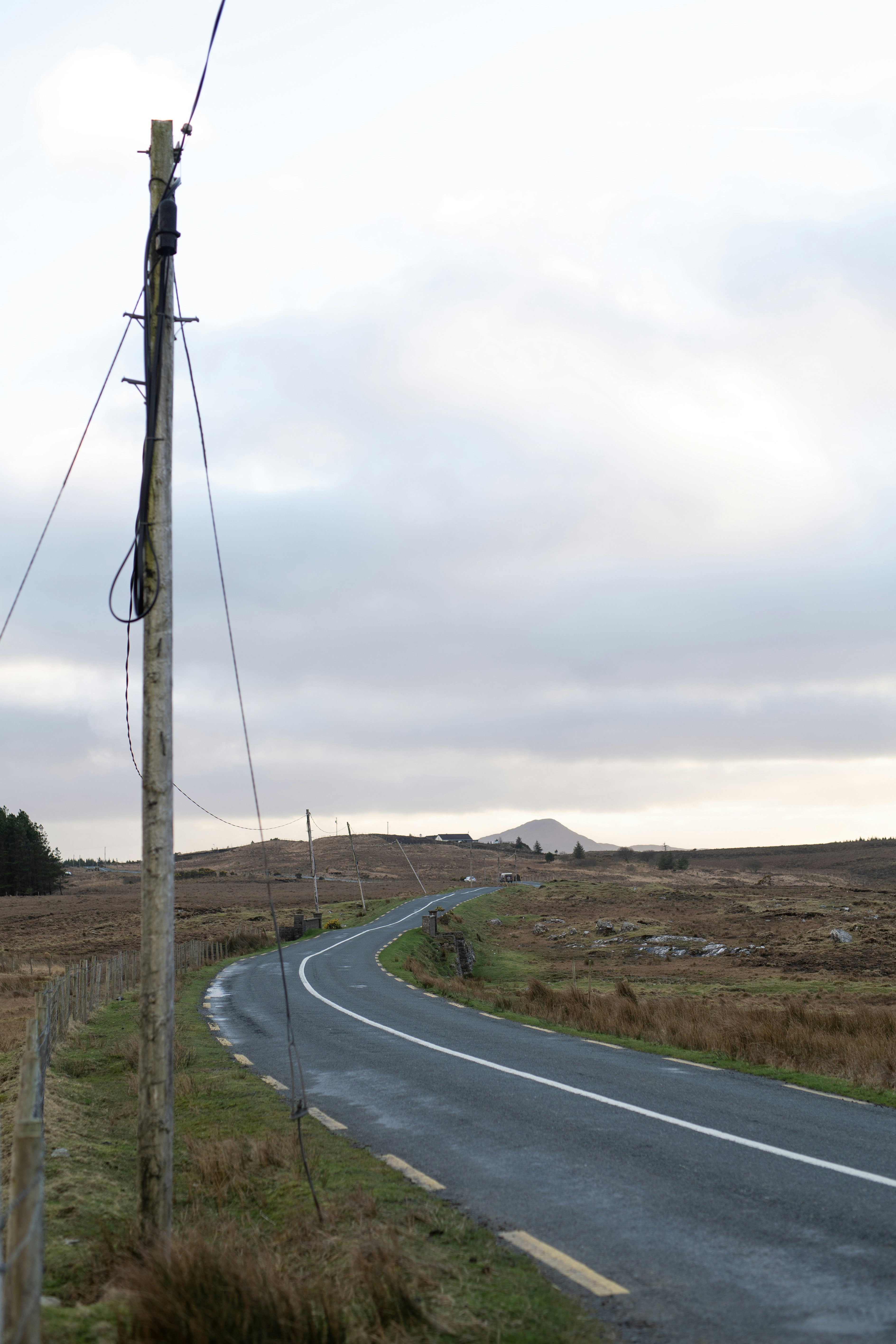 Winding Road Through Open Moorland Under Wide Sky