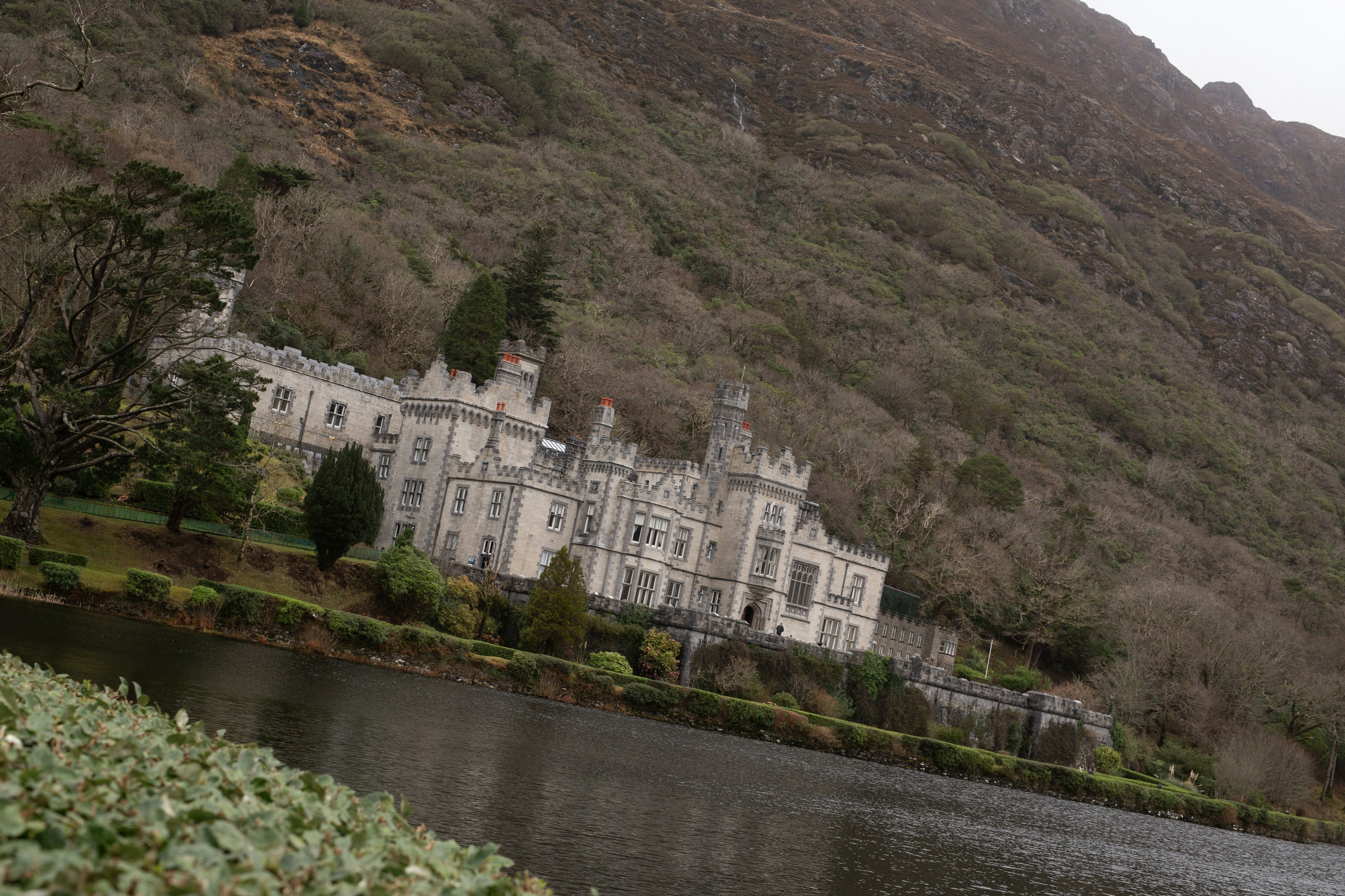 Castle by the Tarn: A Moorland Coastal Chateau Under Grey Skies