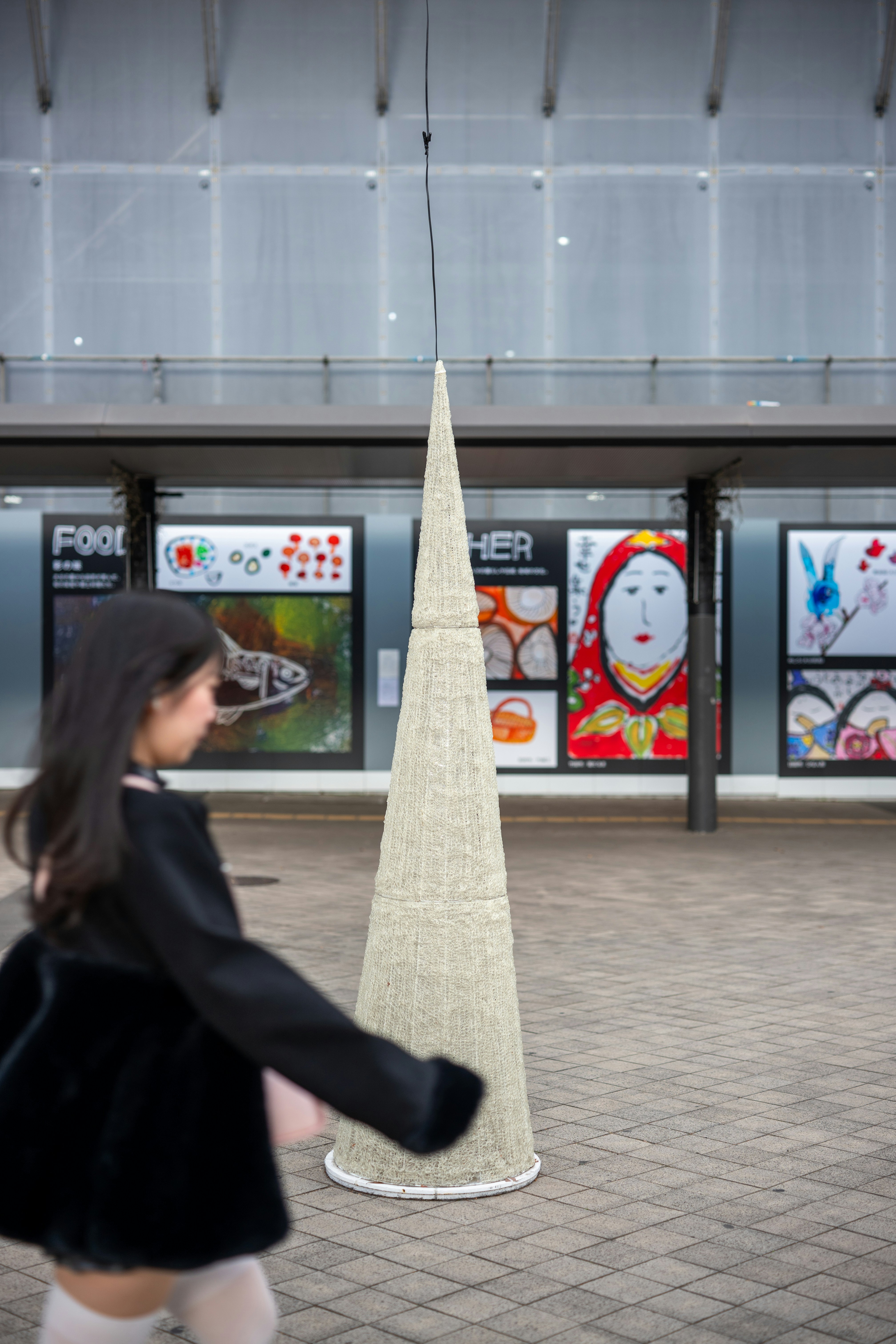 Obelisk in Motion: A City Scene Framed by a Blurred Pedestrian