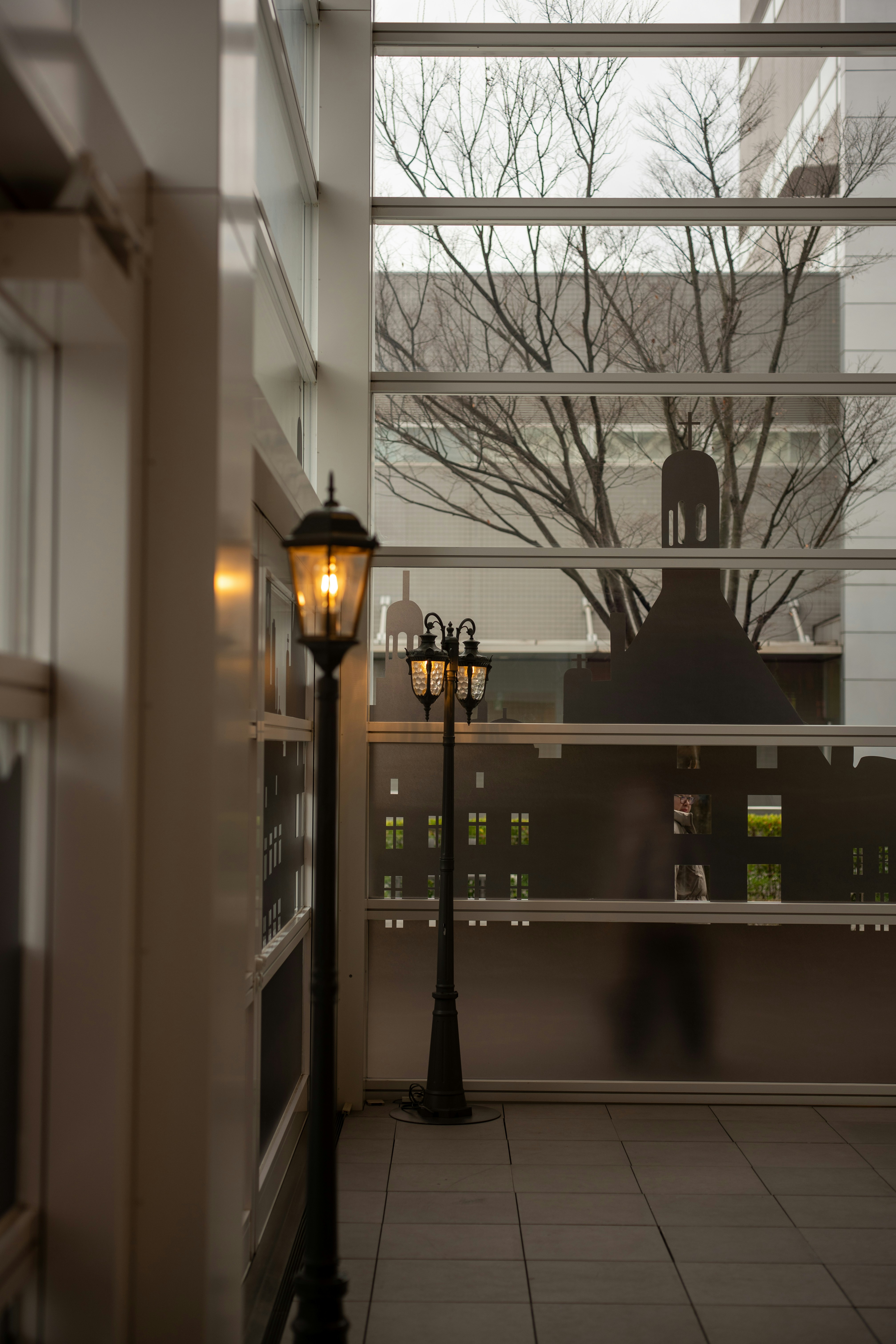 Glowing Street Lamp in a Glass Atrium