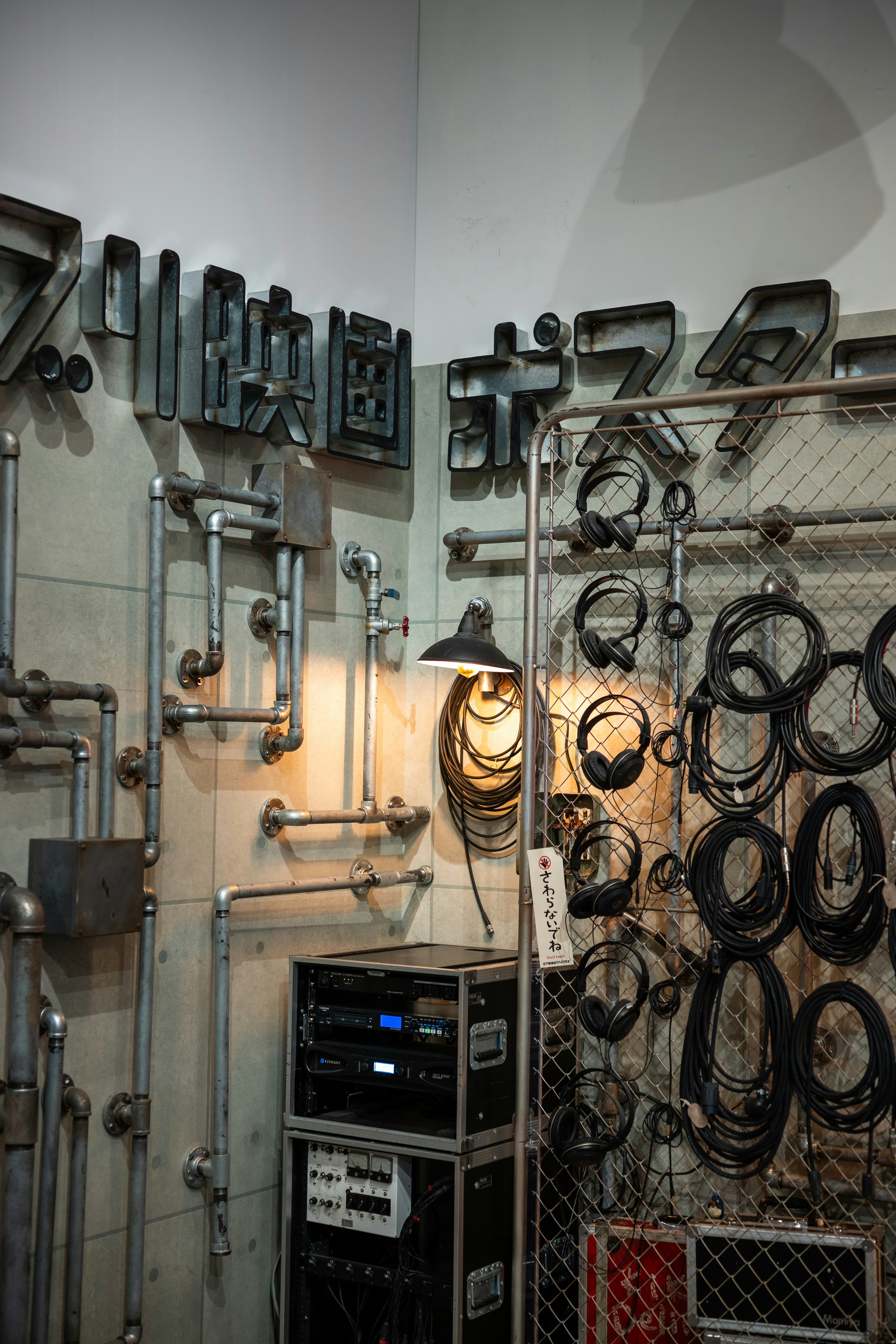 Industrial Studio: Coiled Cables and Meters in a Wiring Workshop