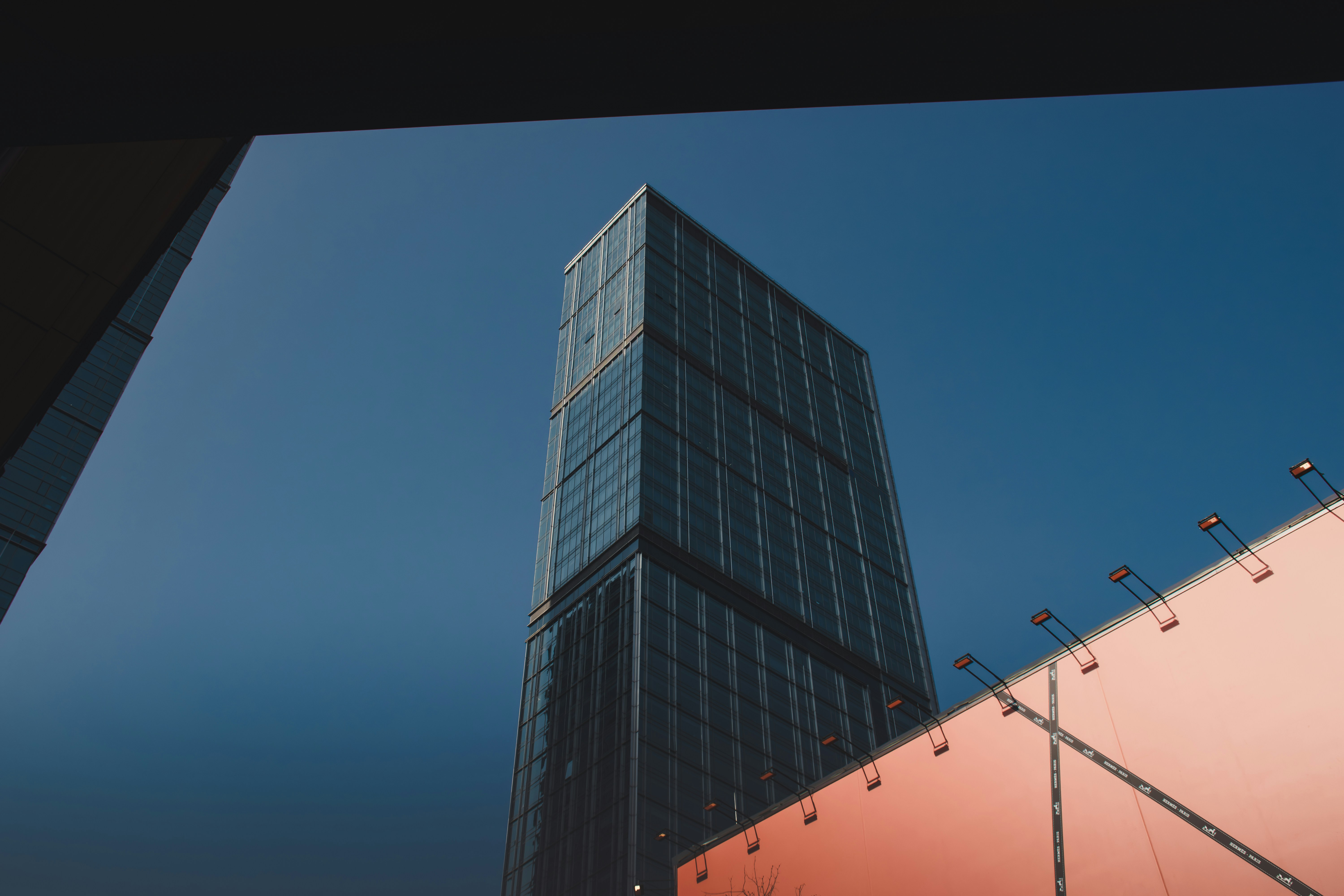 Urban Prism: A Skyscraper Pierces the Blue