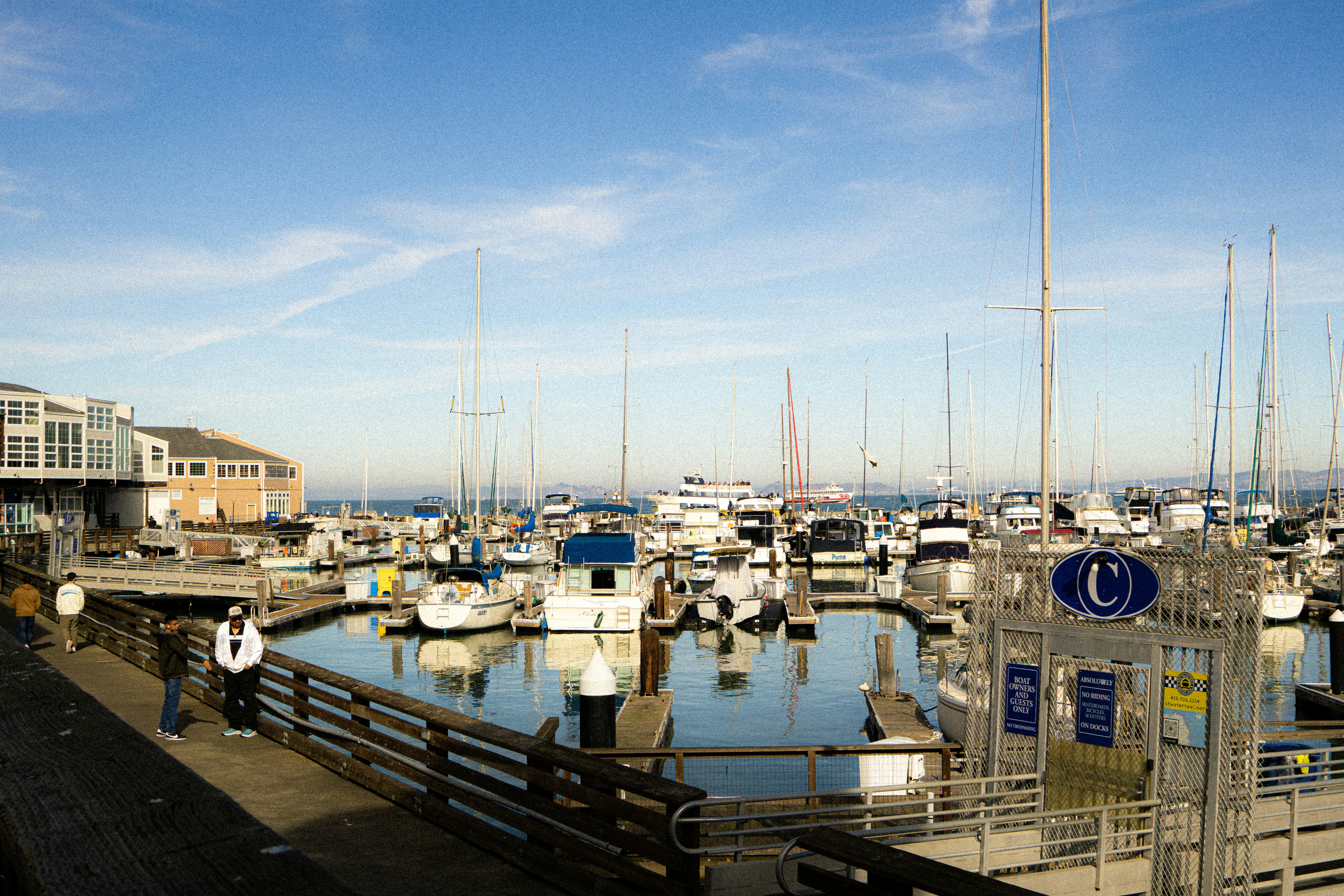 Marina in Dusk: Boats, Reflections, and a Quiet Promenade
