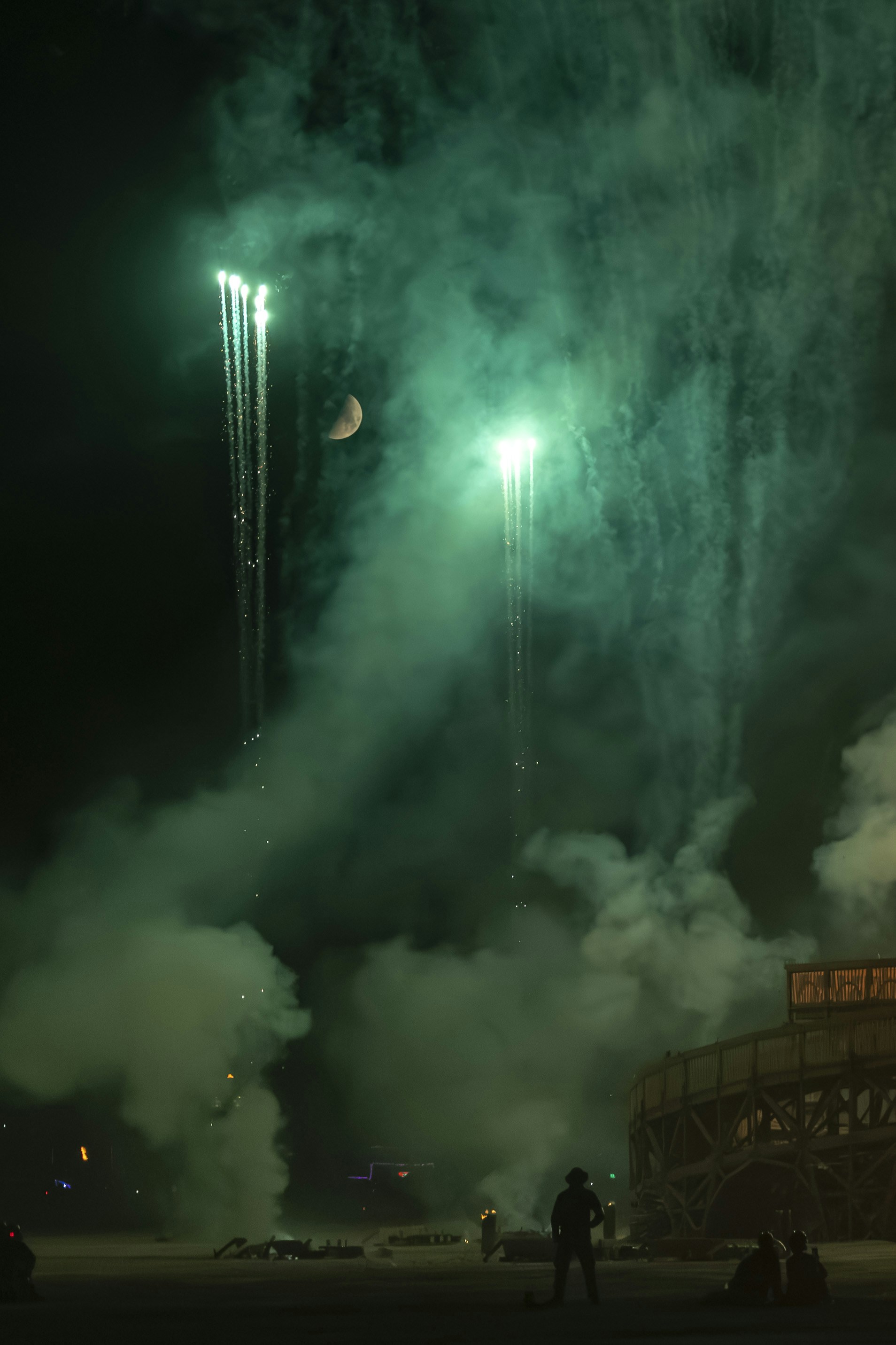 Green Nightfall: Fireworks Over a Foggy Airfield