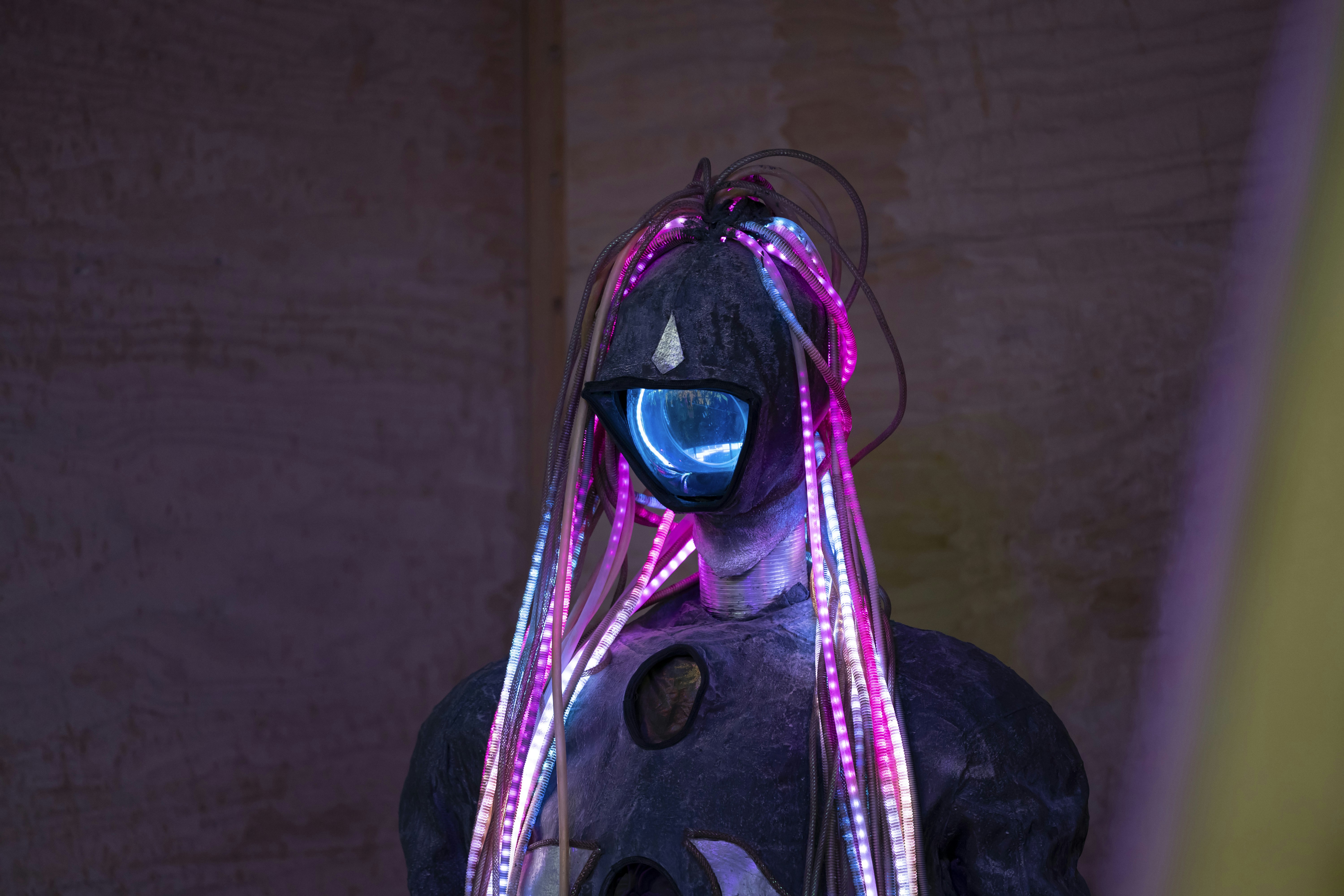 Neon Dread: A Glowing Robotic Muse Stares Into the Void