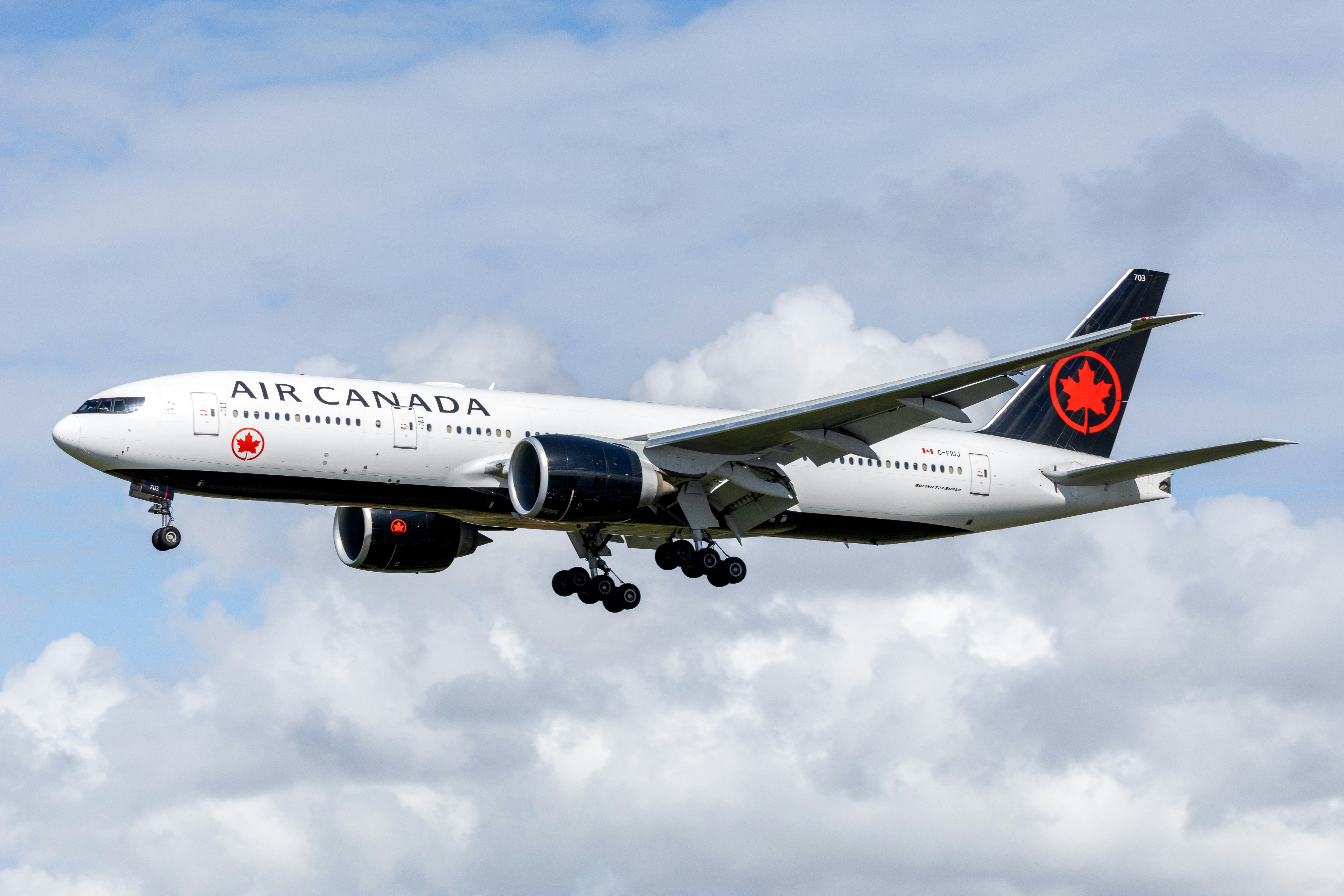 Air Canada in Flight: Wings, Engines, and Sky-Blue Backdrop