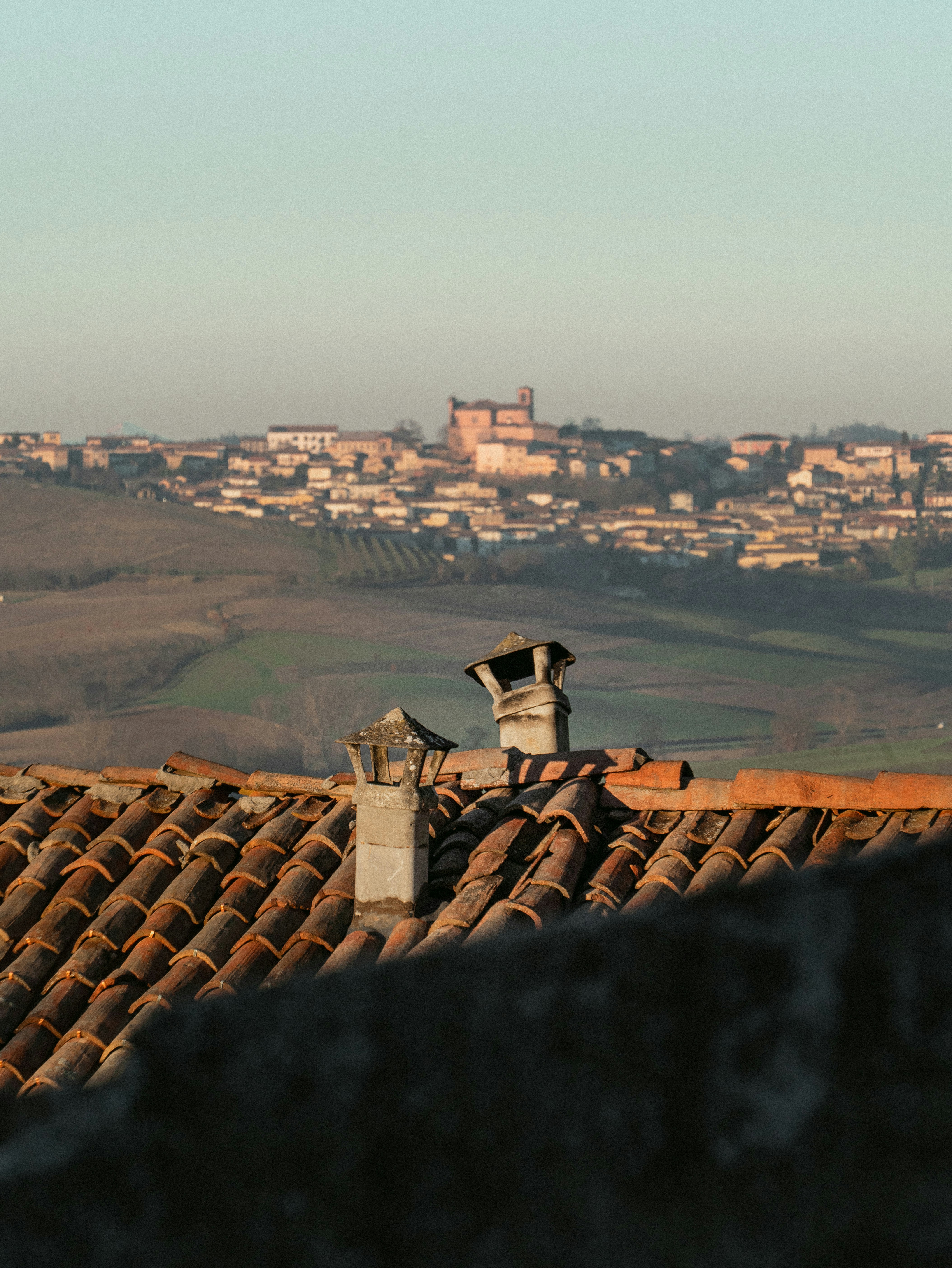 Terracotta Rooftops under a Gentle Horizon
