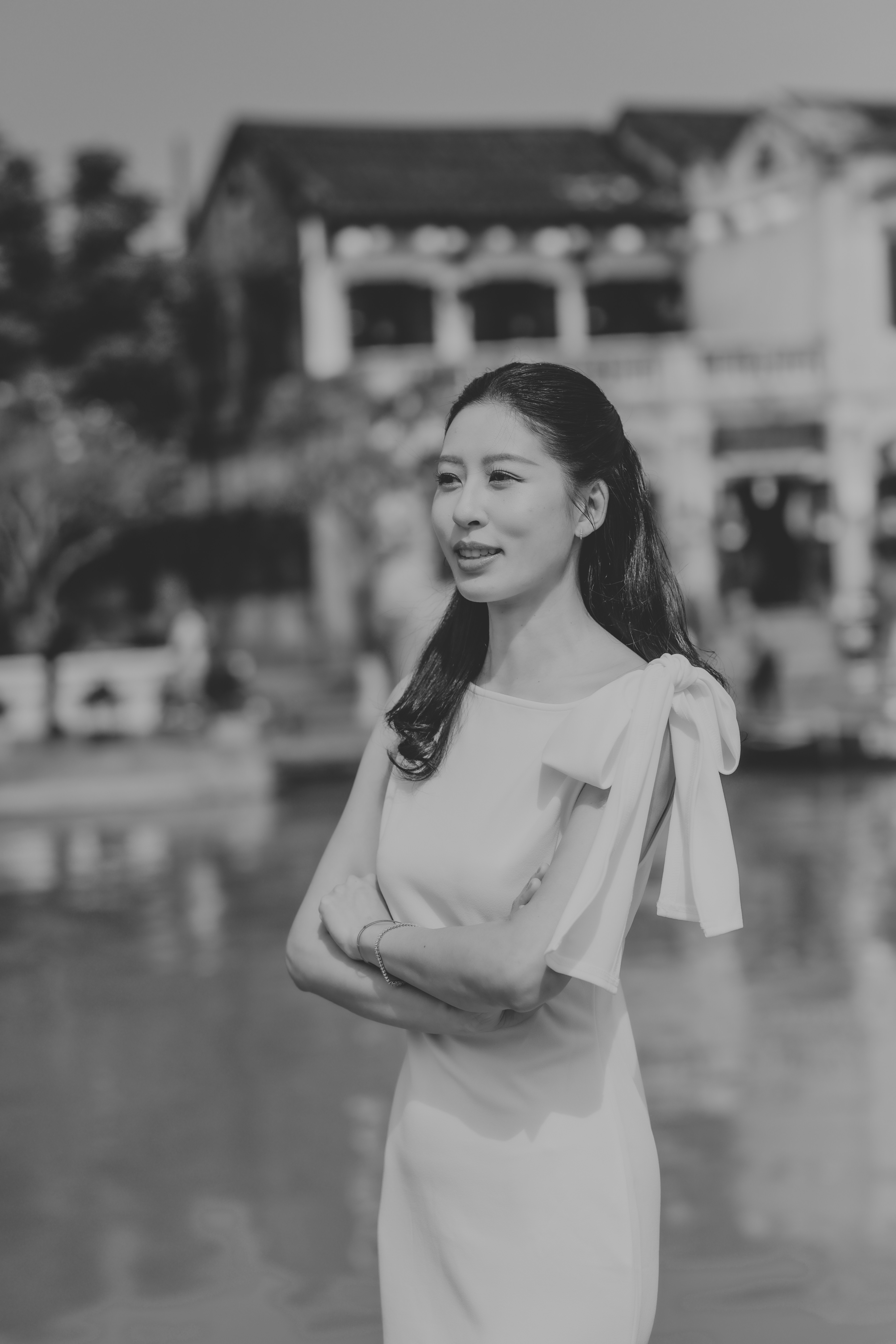Portrait in grayscale: poised elegance by the water’s edge