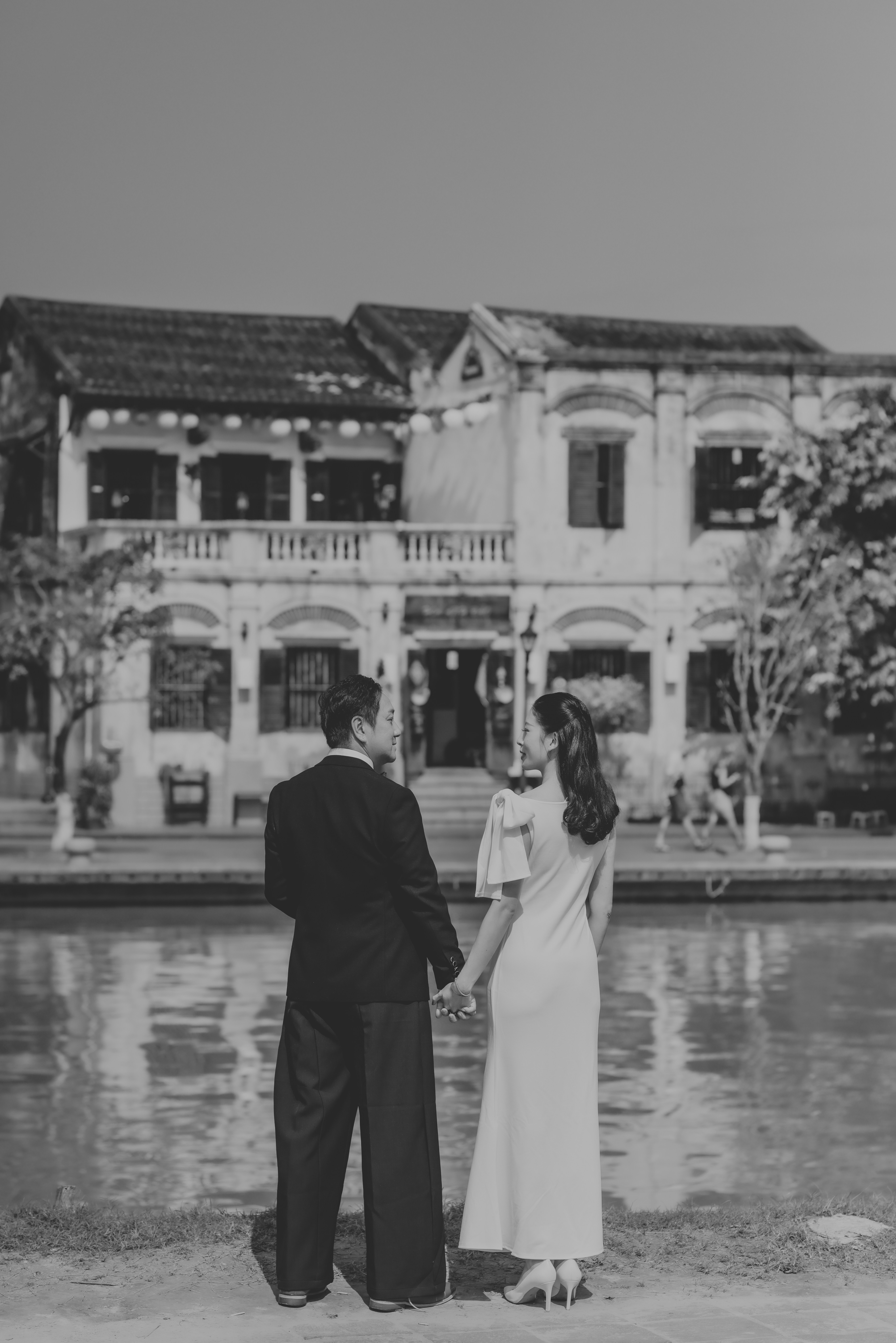 Holding Hands by the Water: A Quiet Vow in Monochrome