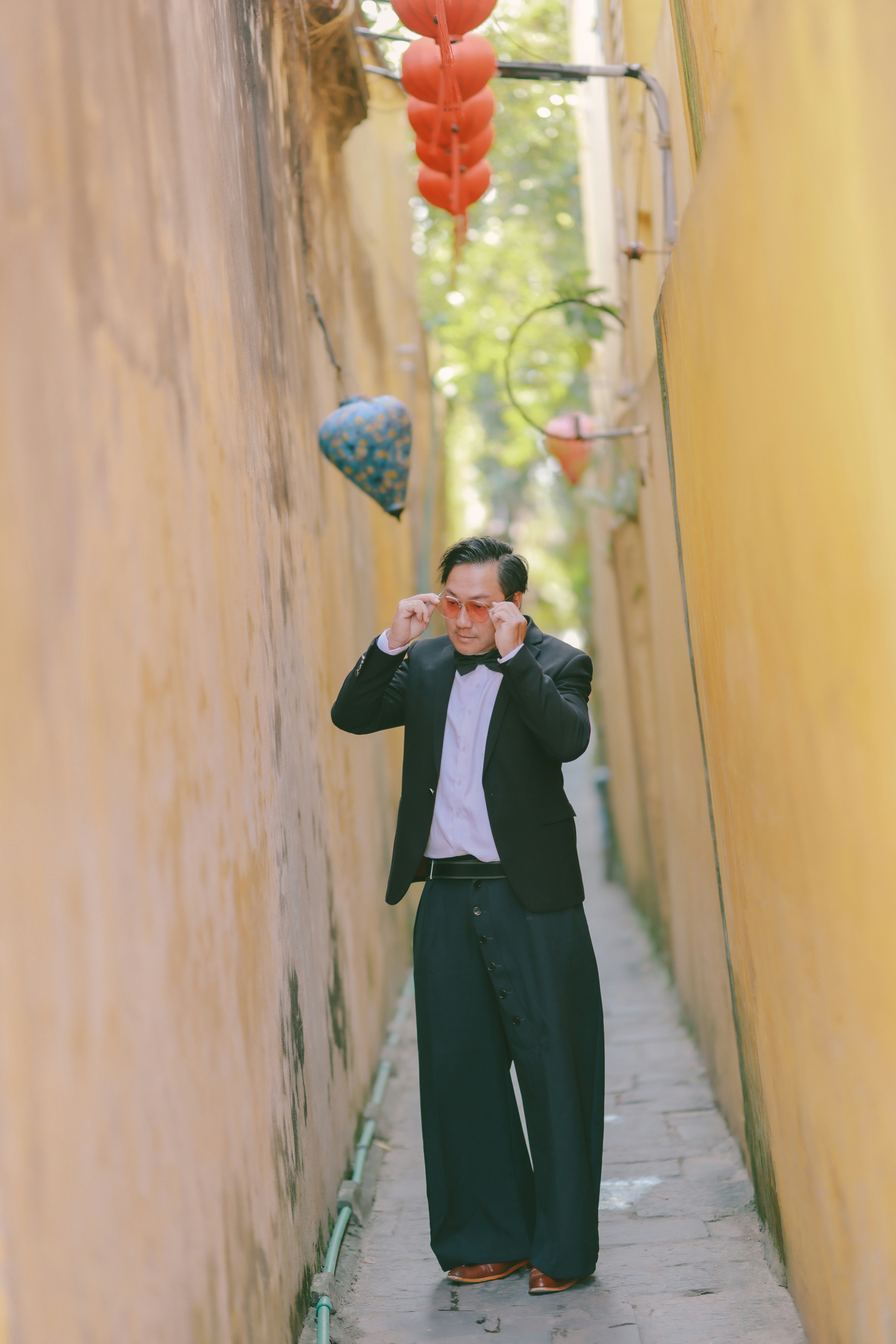 Gentleman in a Sunlit Alley: A Portrait in a Narrow Lane