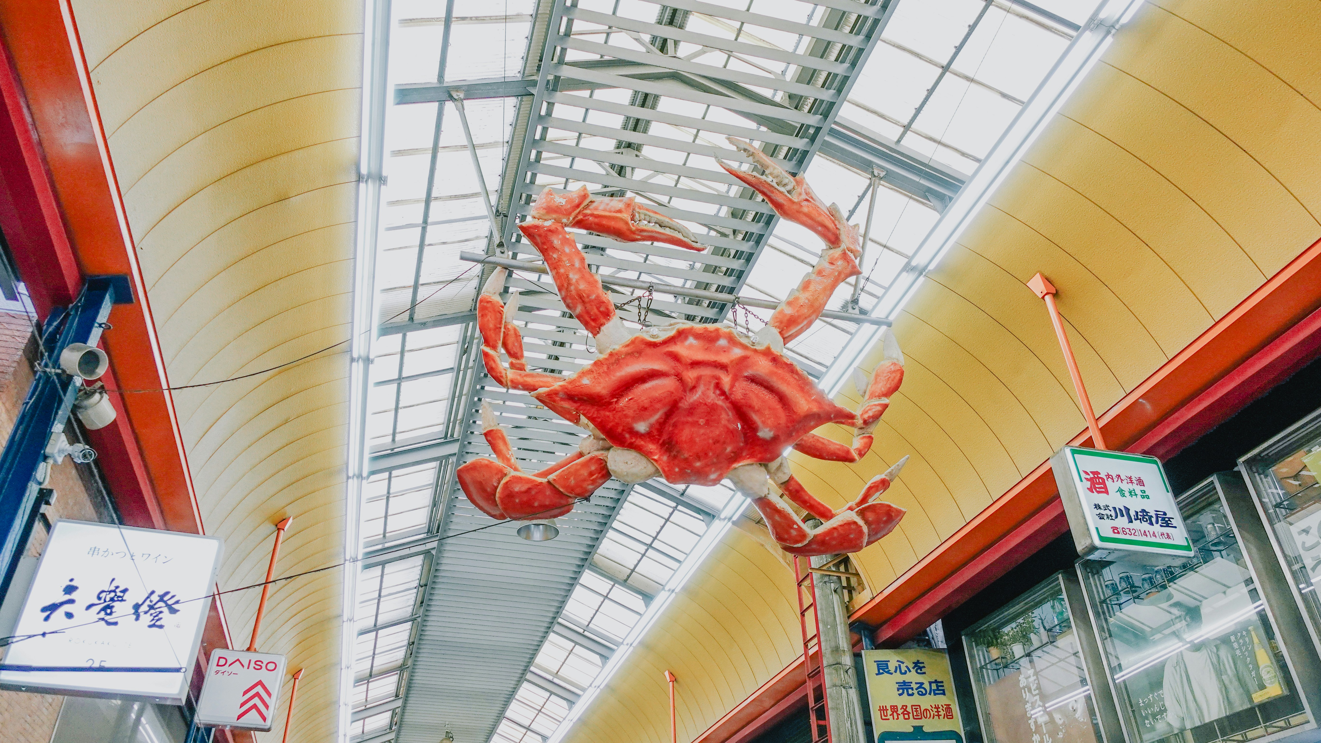 Giant Red Crab Suspended under Aisle Glass—Urban Market Screams Color