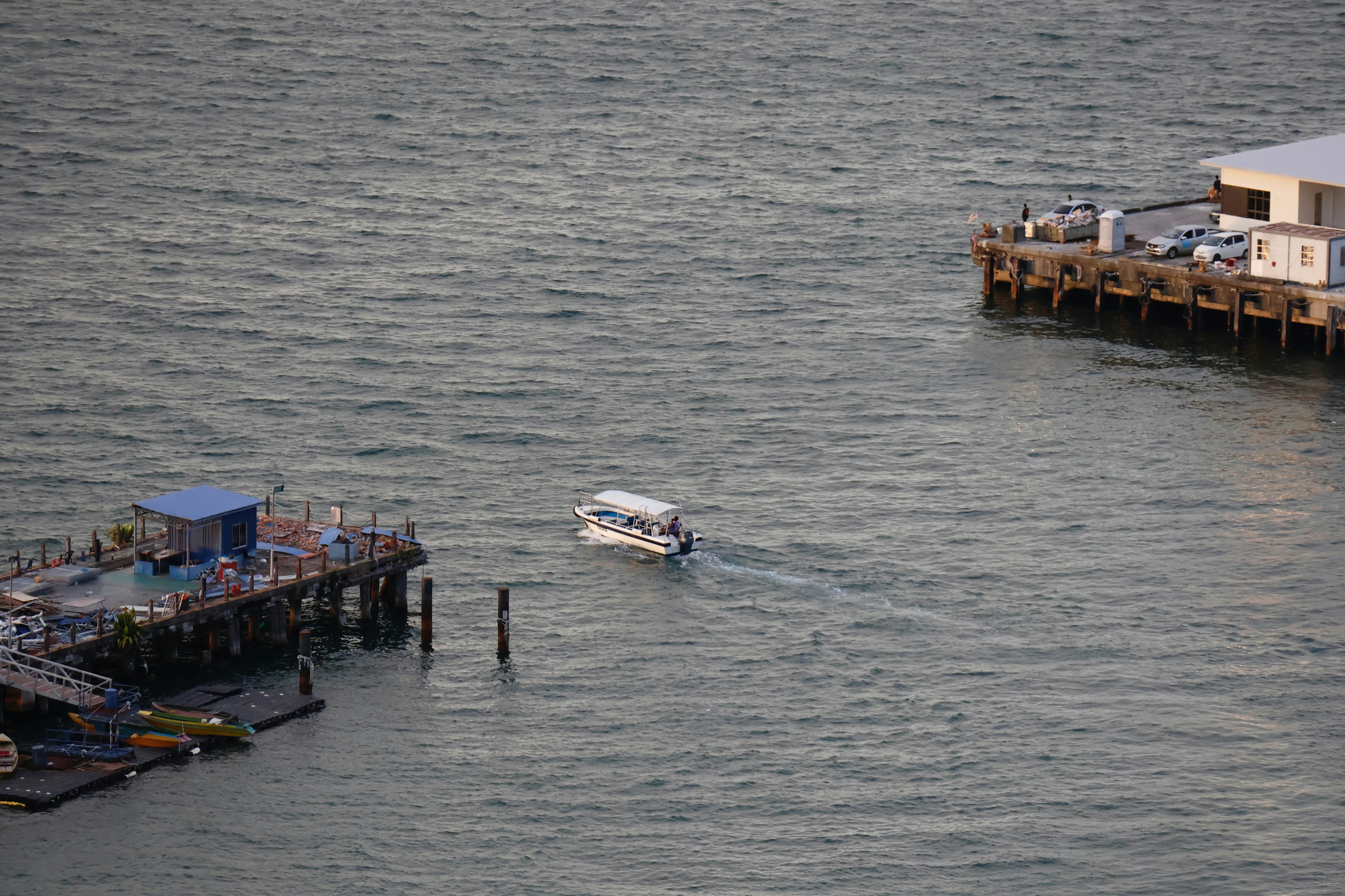 Small Boat Between Docks: Quiet Waterback Scene