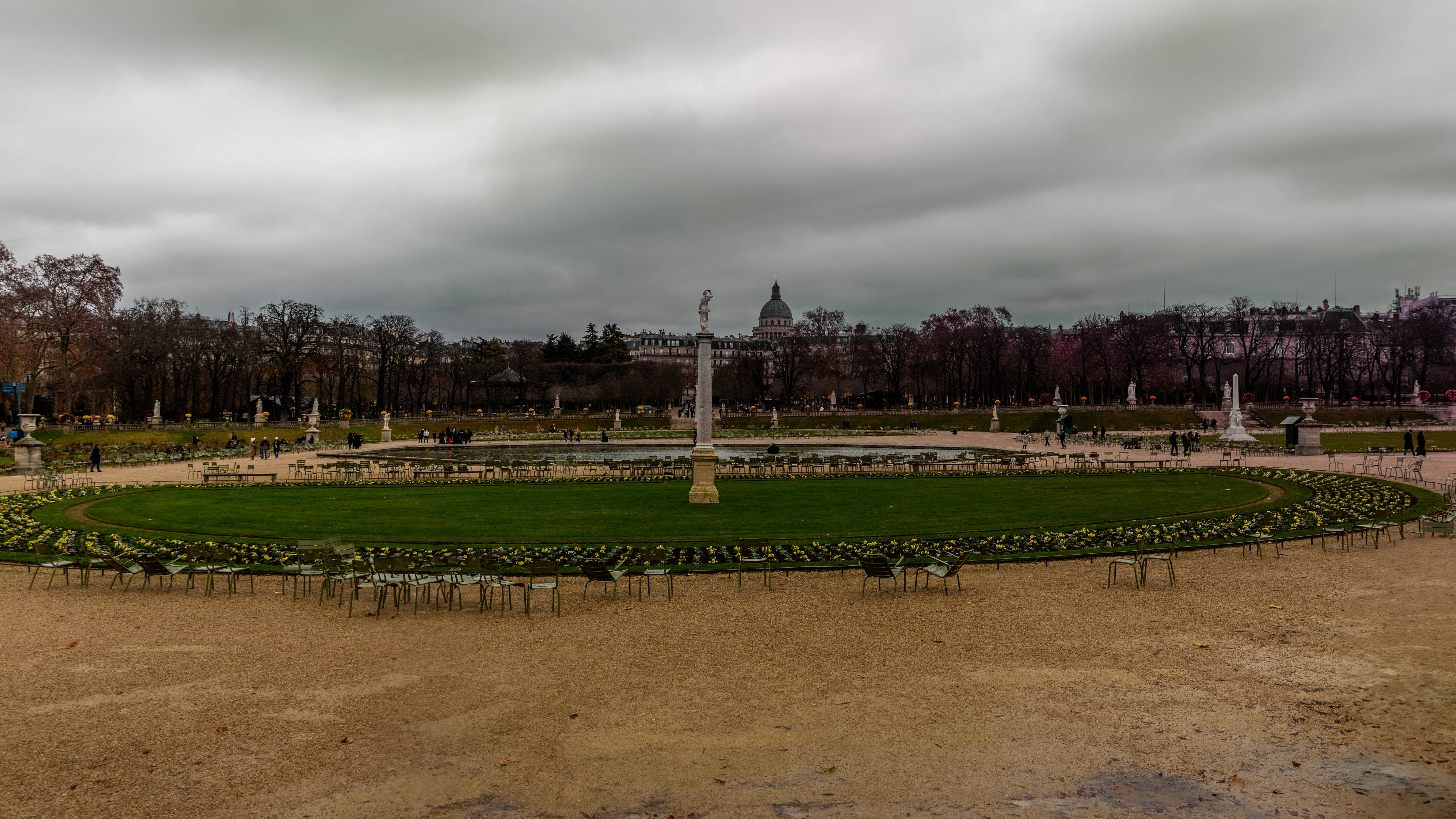 Symmetrical Versailles-Style Lawn Framed by Colonnades and Statues