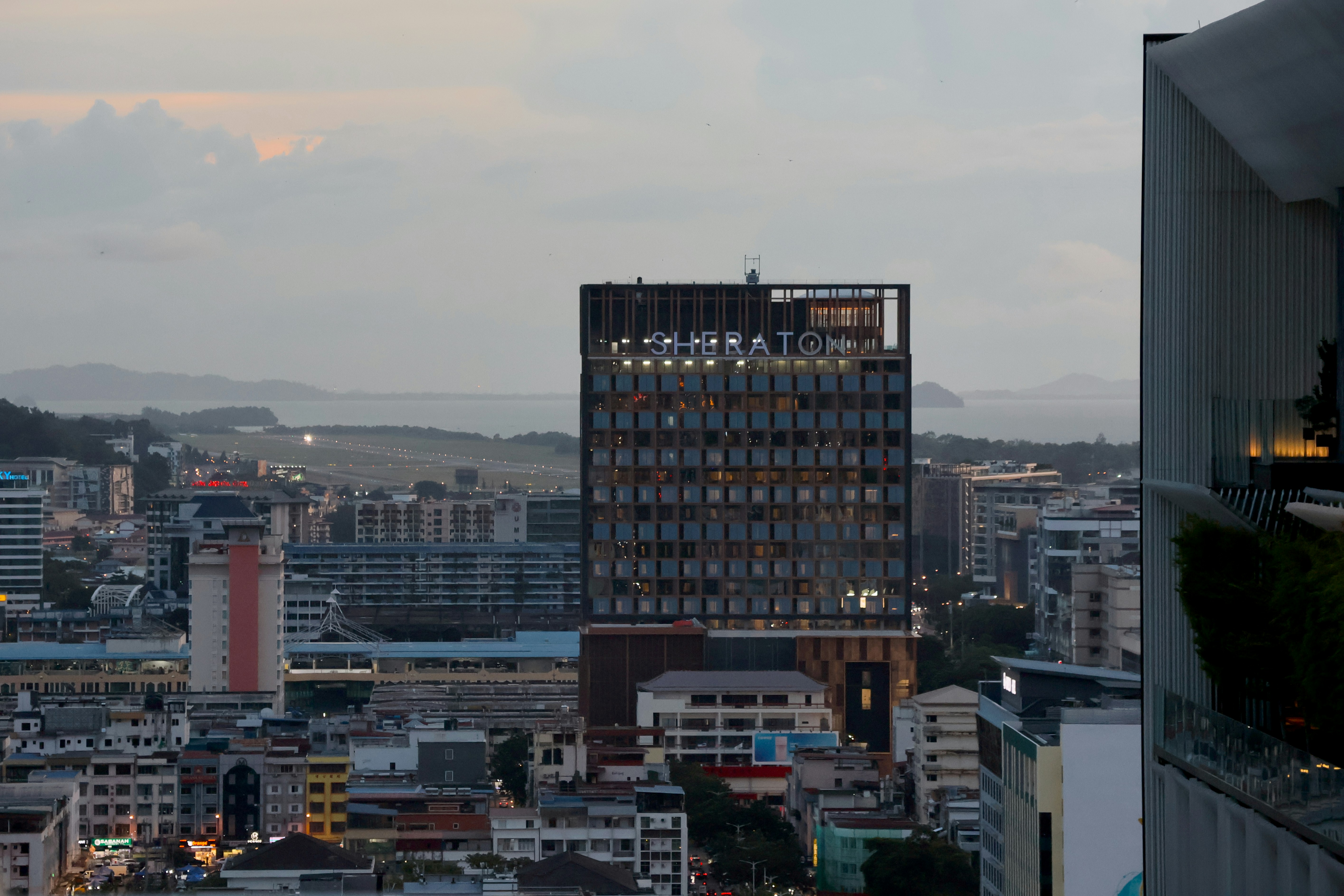 Midday Glass and Grid: The Corporate Core Rising Above a Coastal City