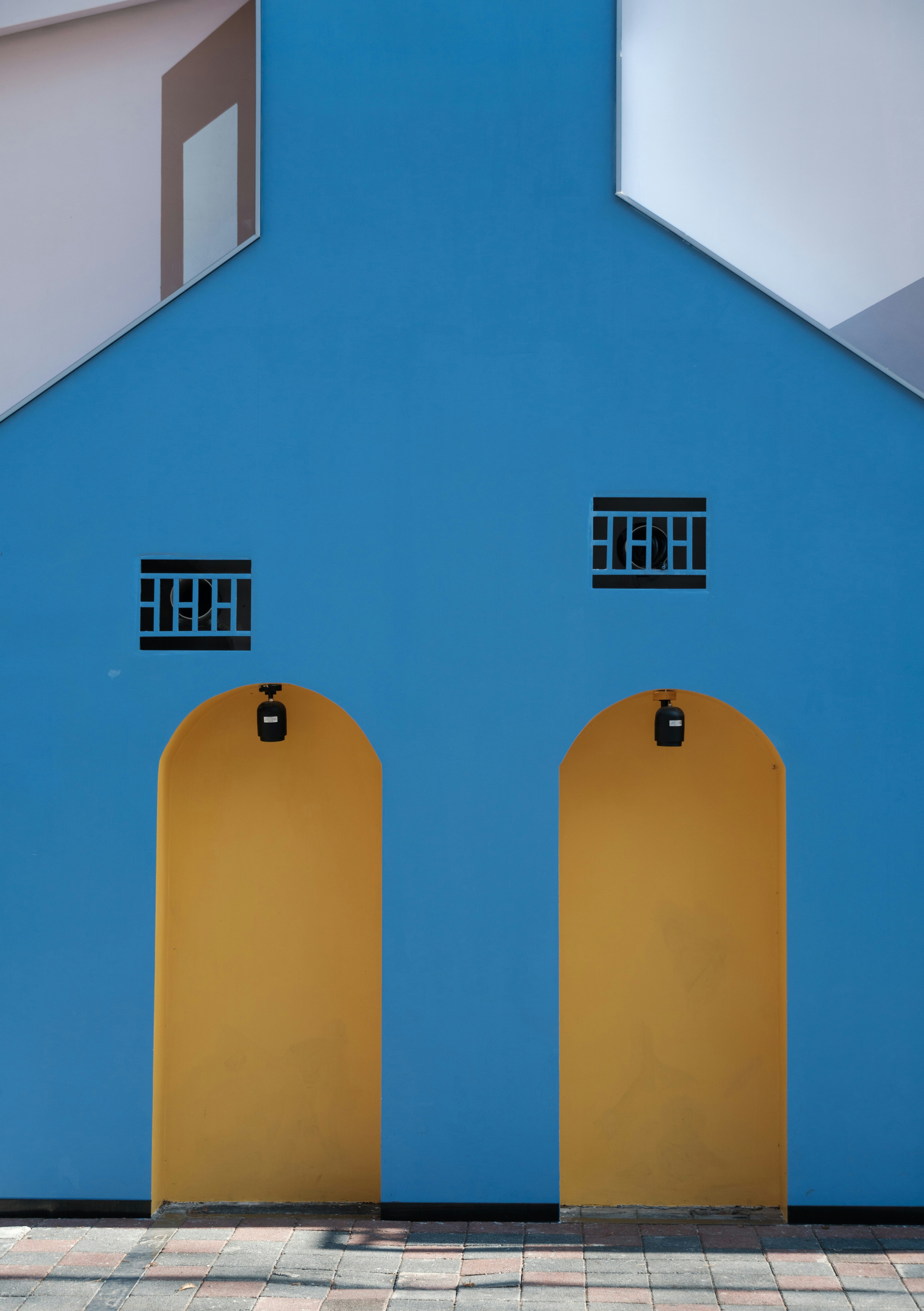 Blue Facade, Golden Doorways: A Playful Architecture