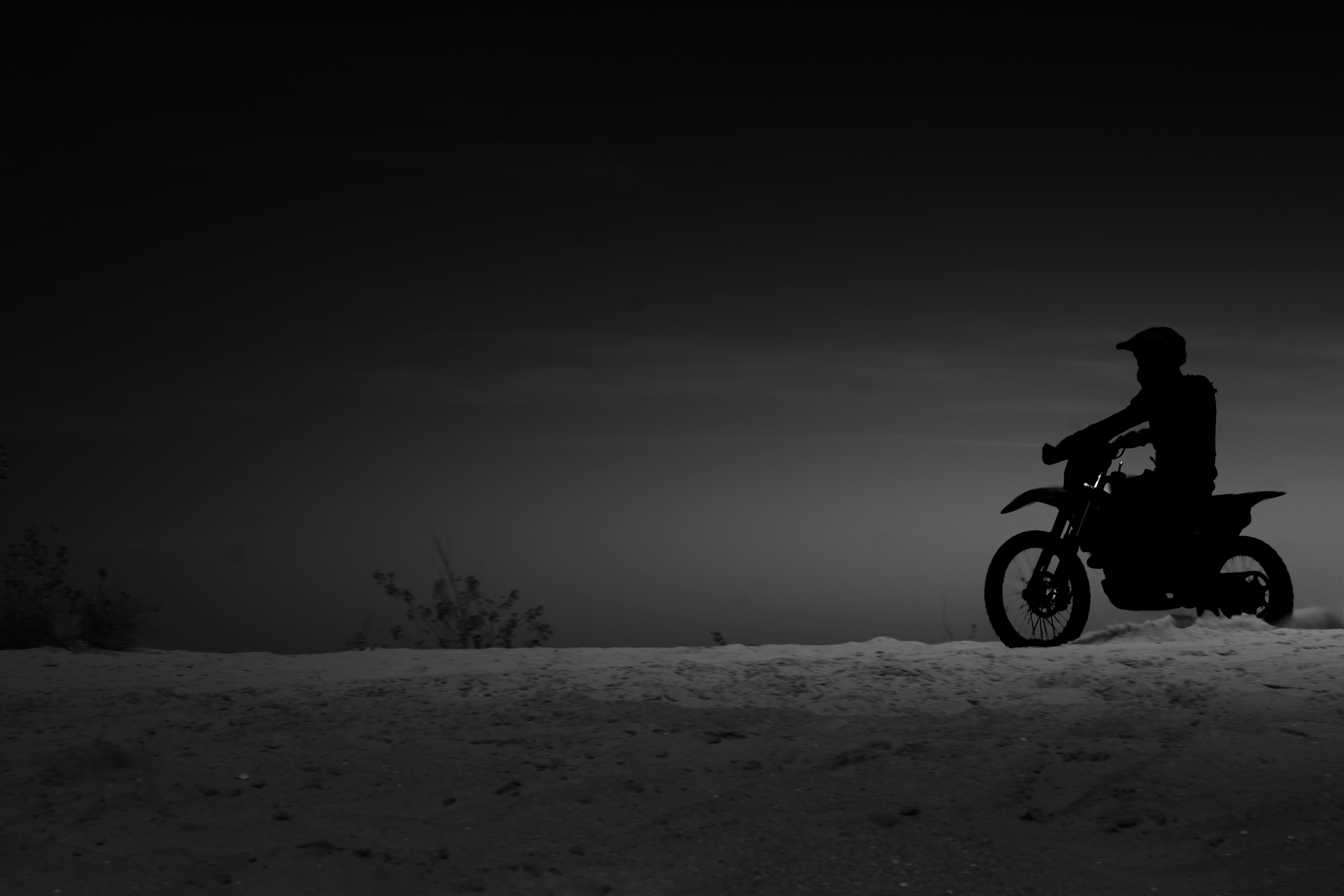 Silhouette at Dusk: A lone rider on the horizon