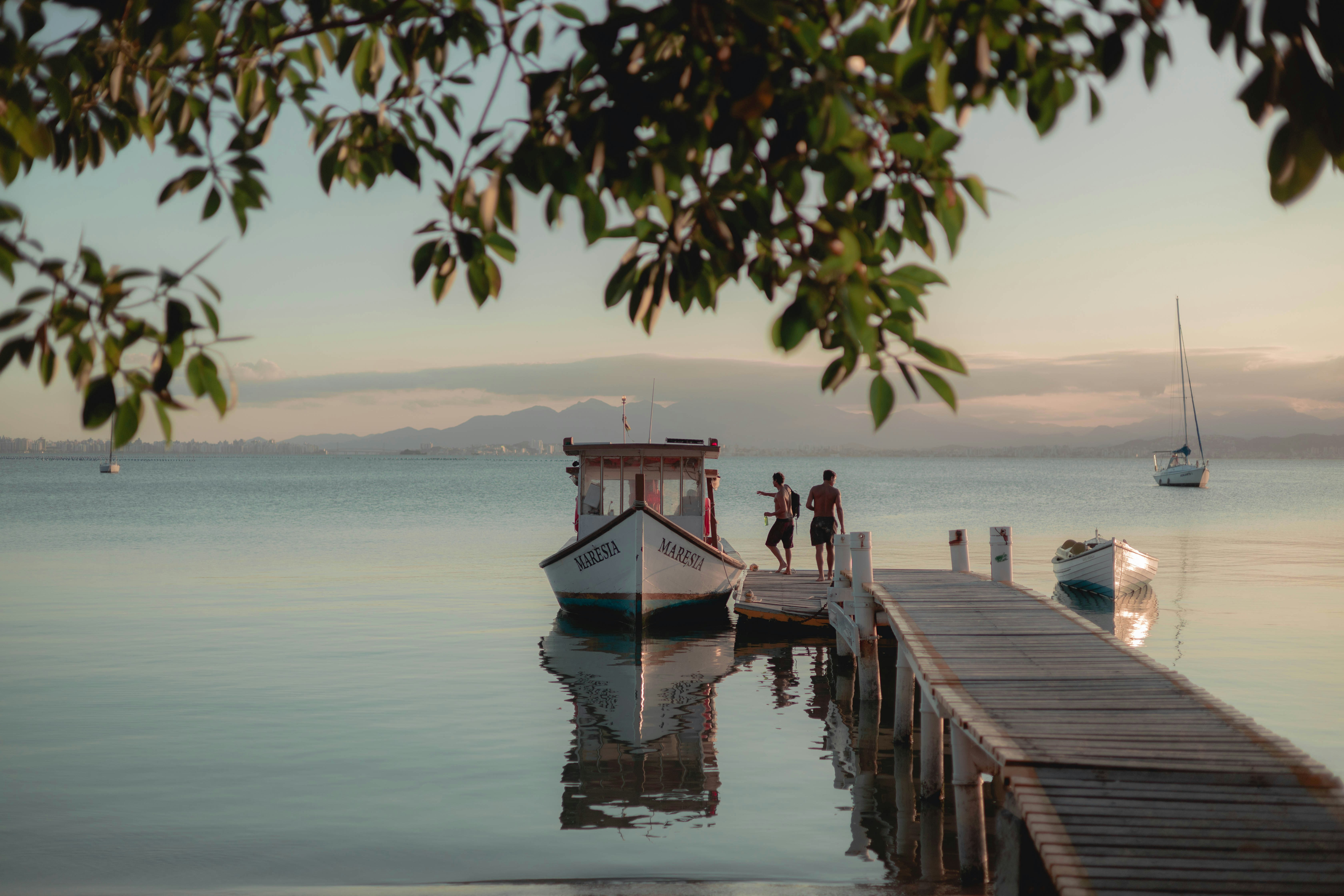 Pier at Dusk: A Quiet Boat Reach Anchored by Calm Waters