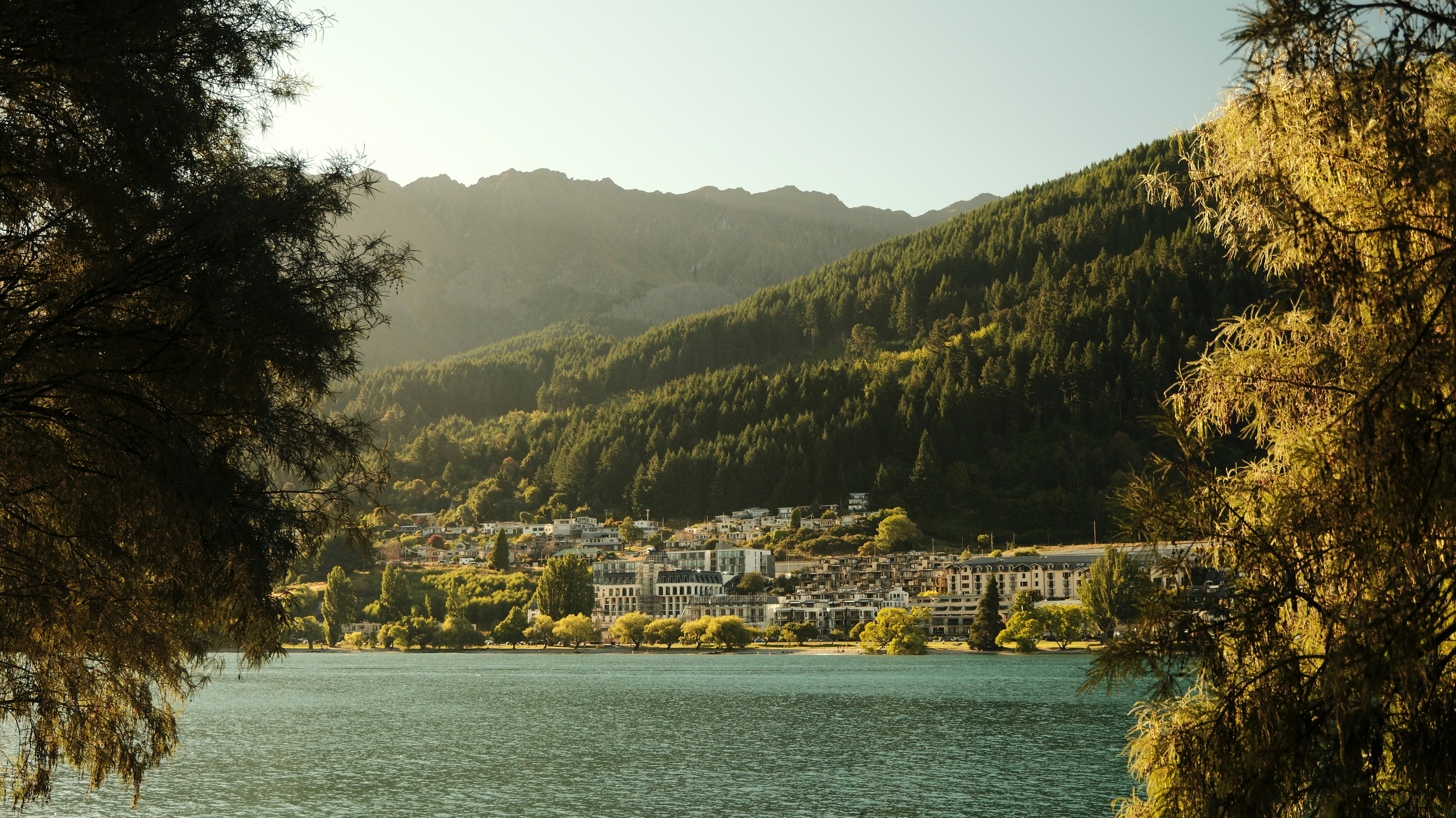 Lakeside Village Nestled Between Sunlit Pines