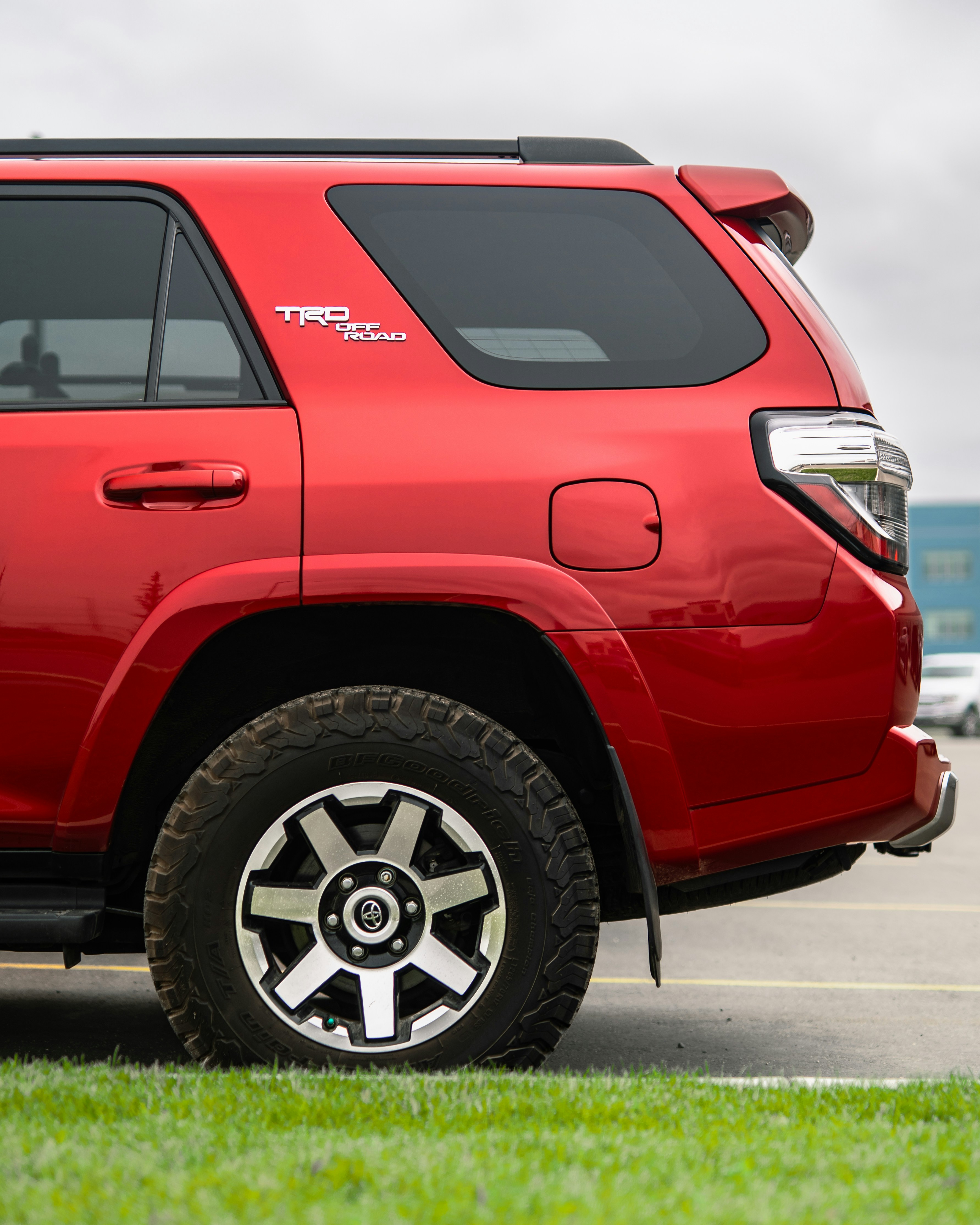 Red SUV Rear Quarter in a Quiet Parking Lot