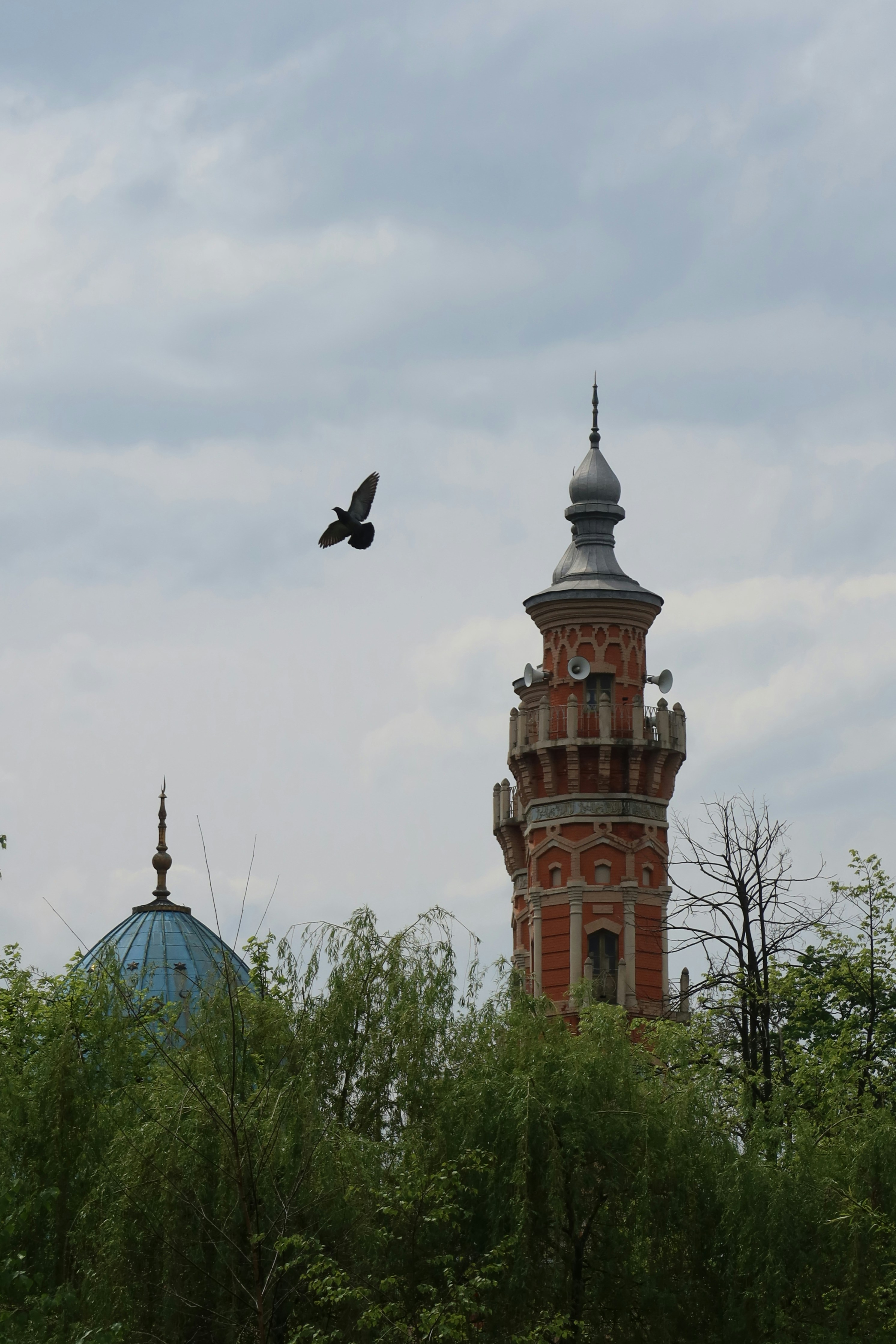 Towering Red Brick Spire Anticipates a Flight