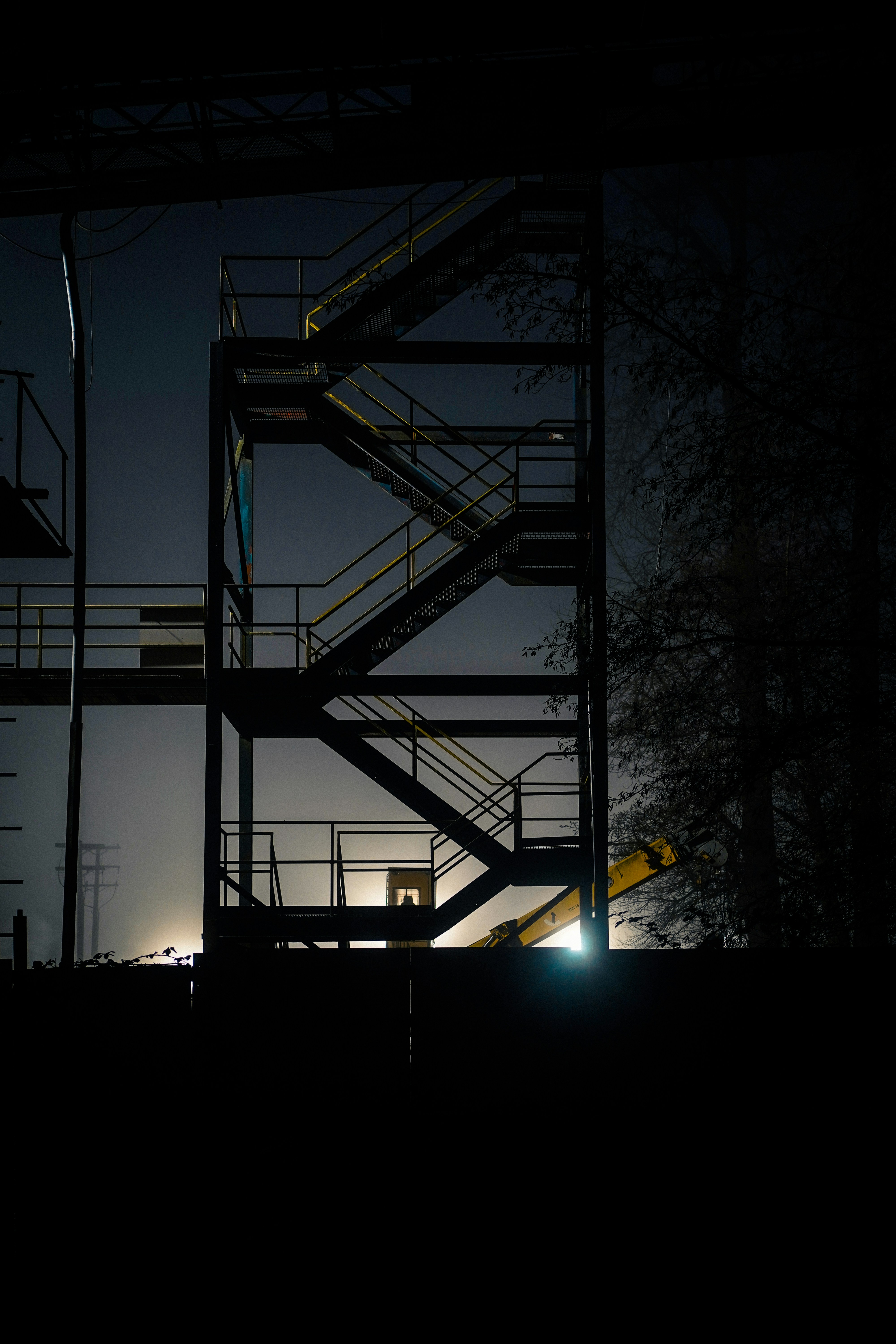 Night Staircase Geometry Against a Dim Skyline
