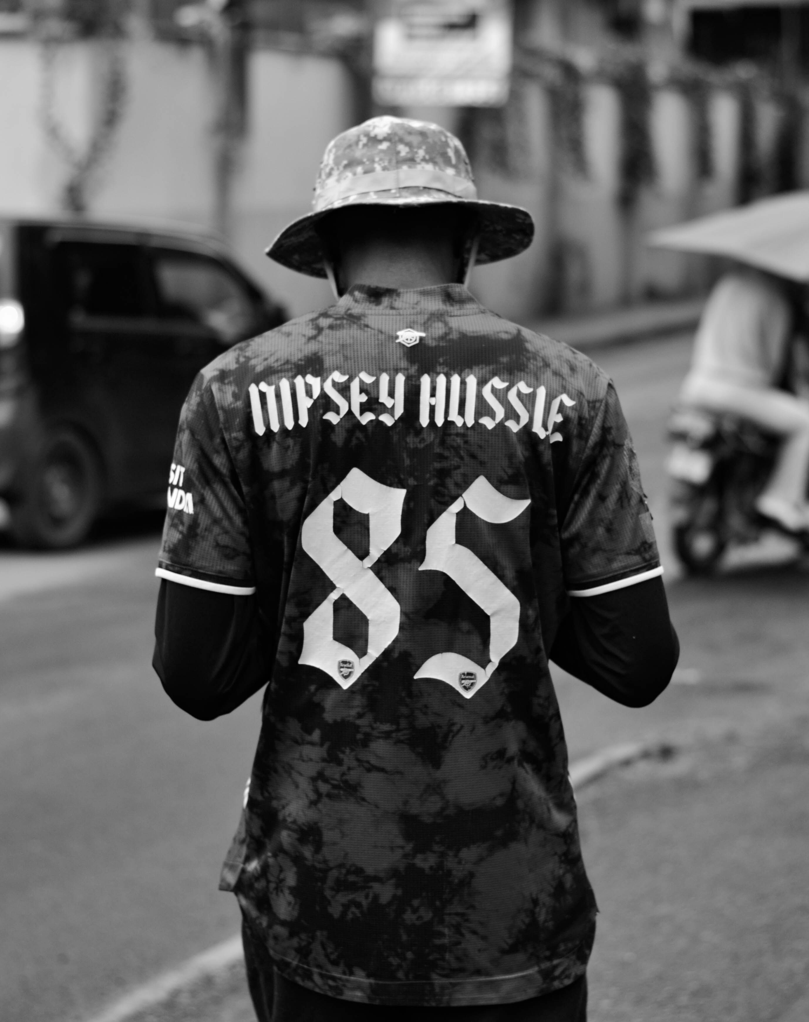 Backturned in Patterned Gear: A Street Portrait