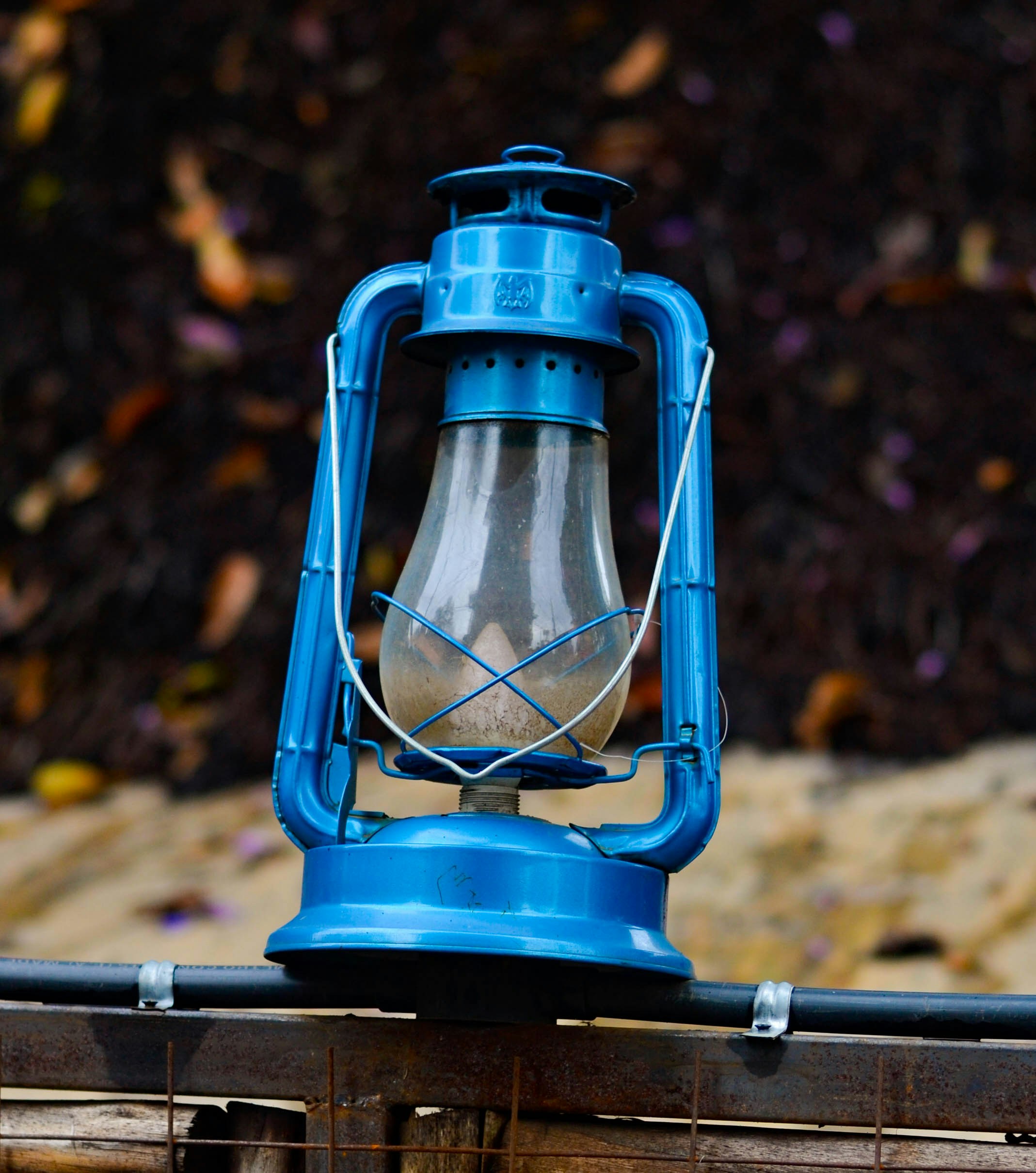Azure Lantern on the Rails: The Quiet Standings of a Tool Against a Dark Background
