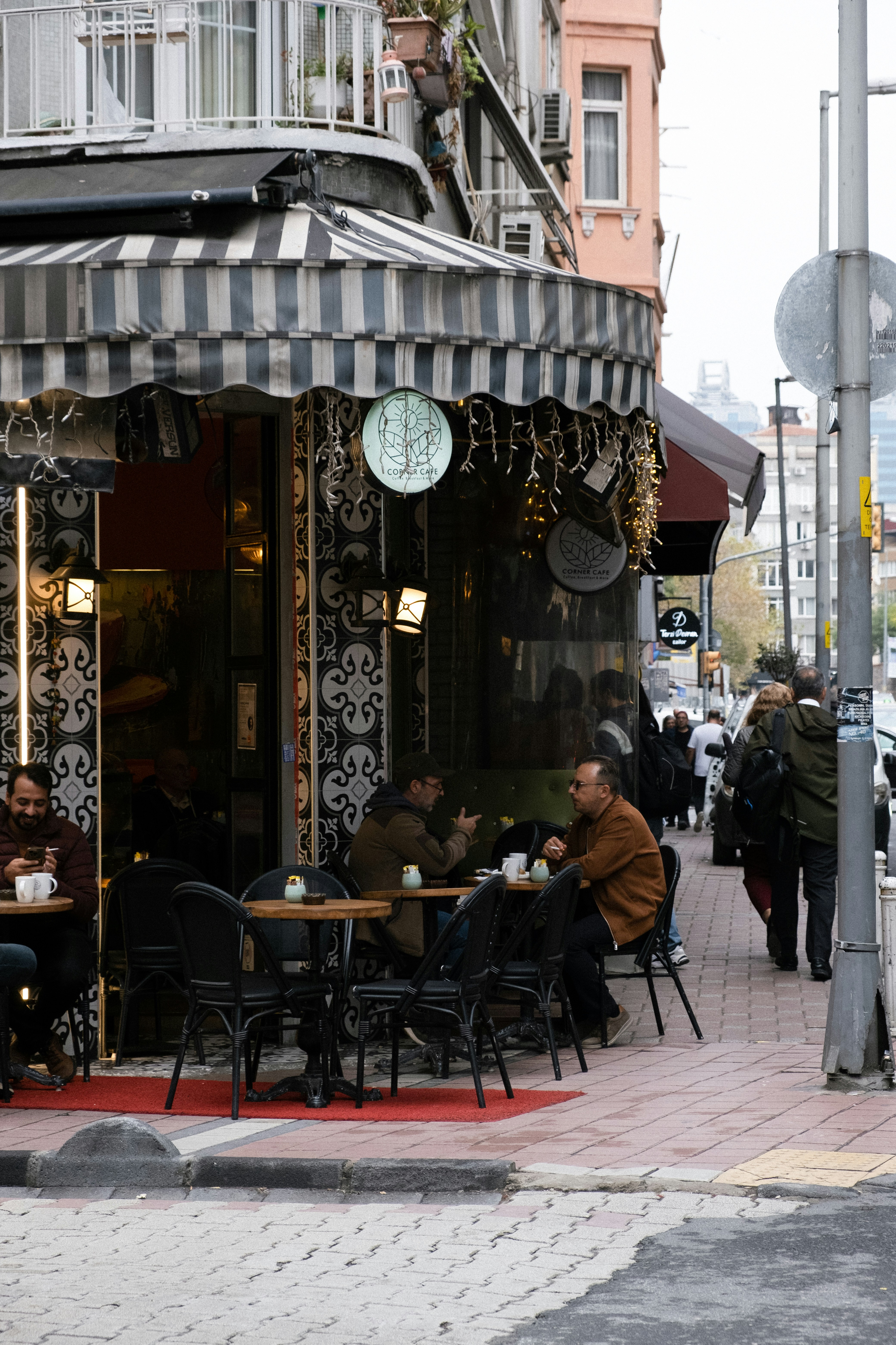 Café Corner: Soft Evening Glow Under Striped Canopy