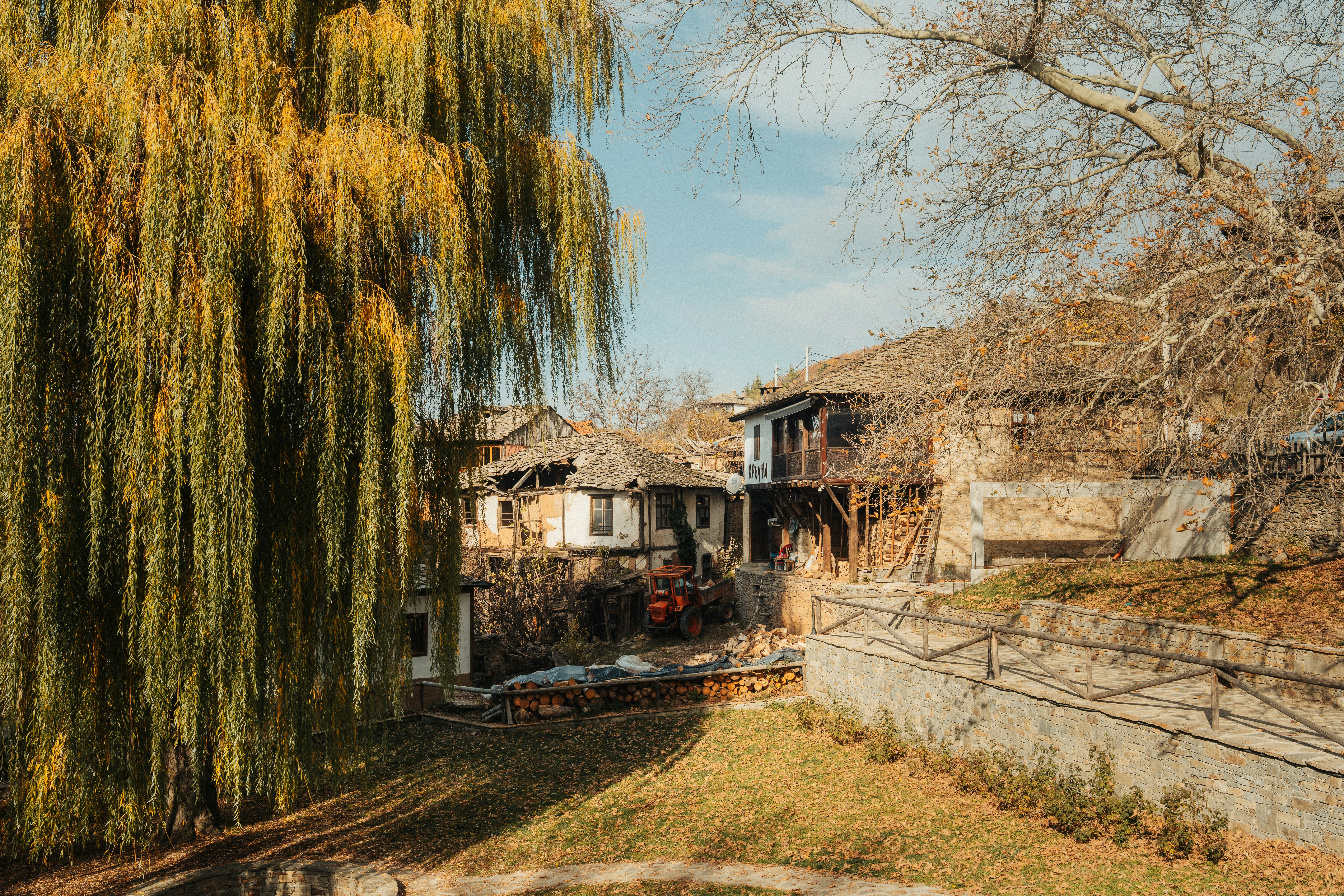 Sunlit Rural Courtyard with Weathered Structures