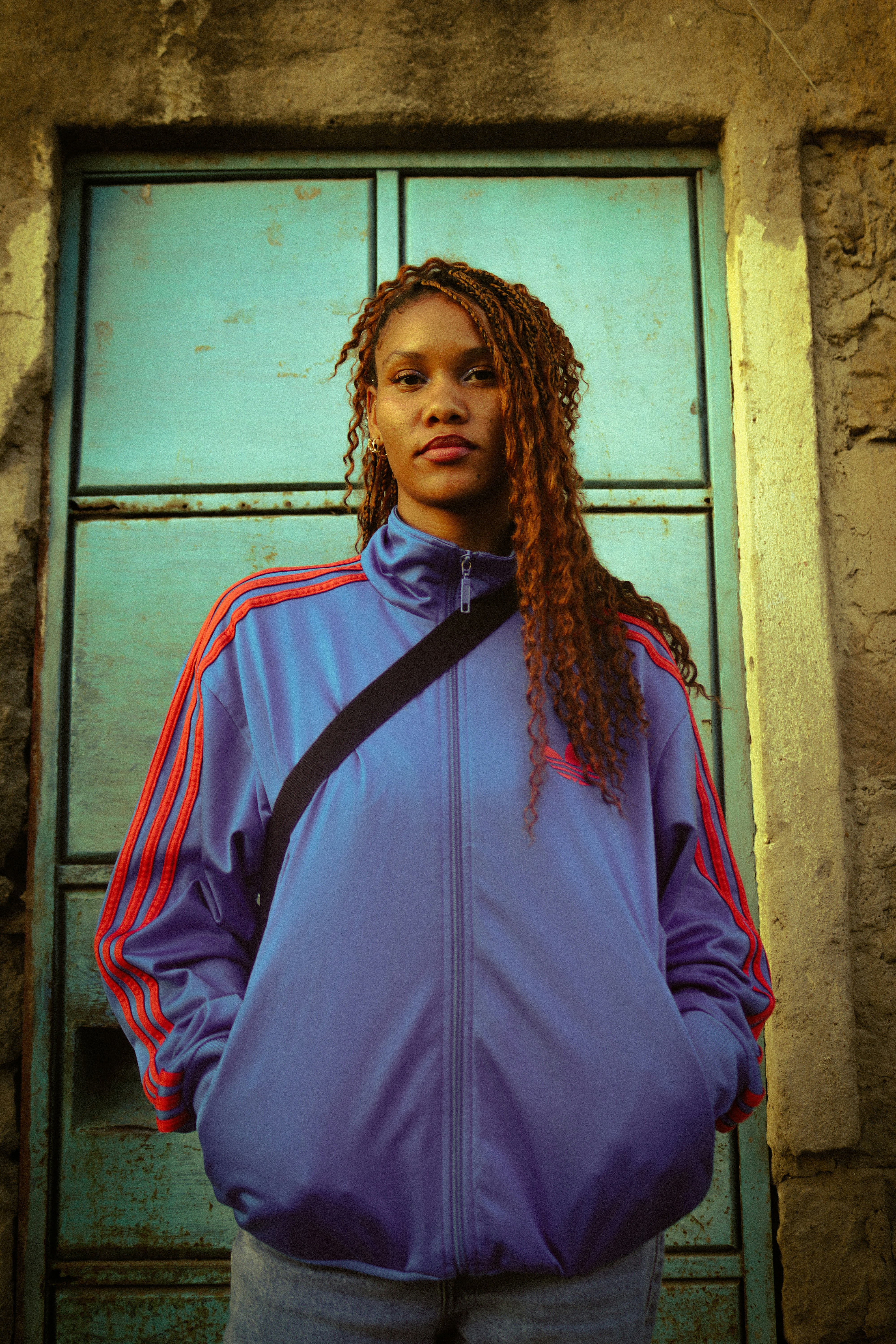 Urban Confidence: A Portrait in Teal and Straps