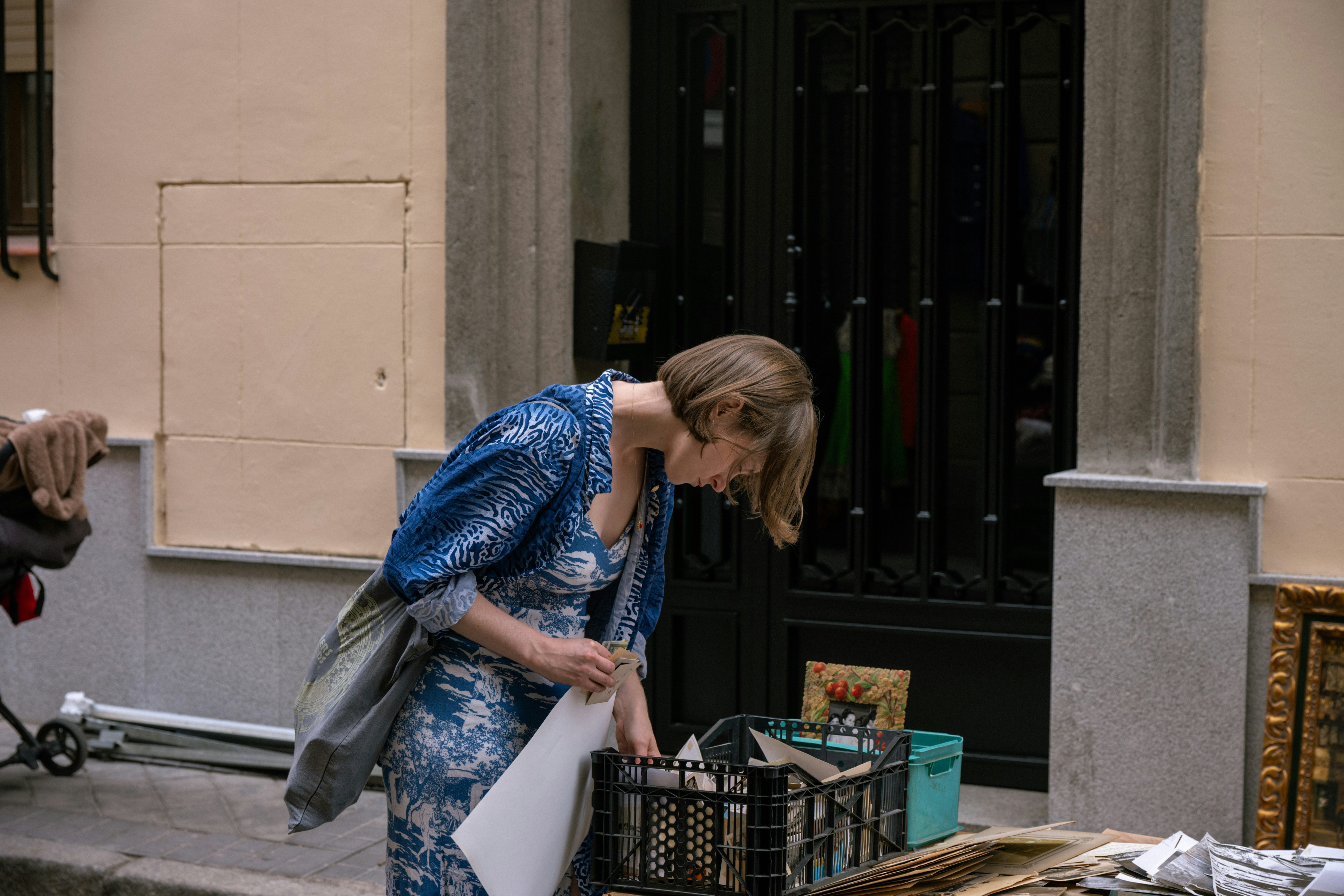 Browsing the Market Stalls: A Quiet Moment in the Street