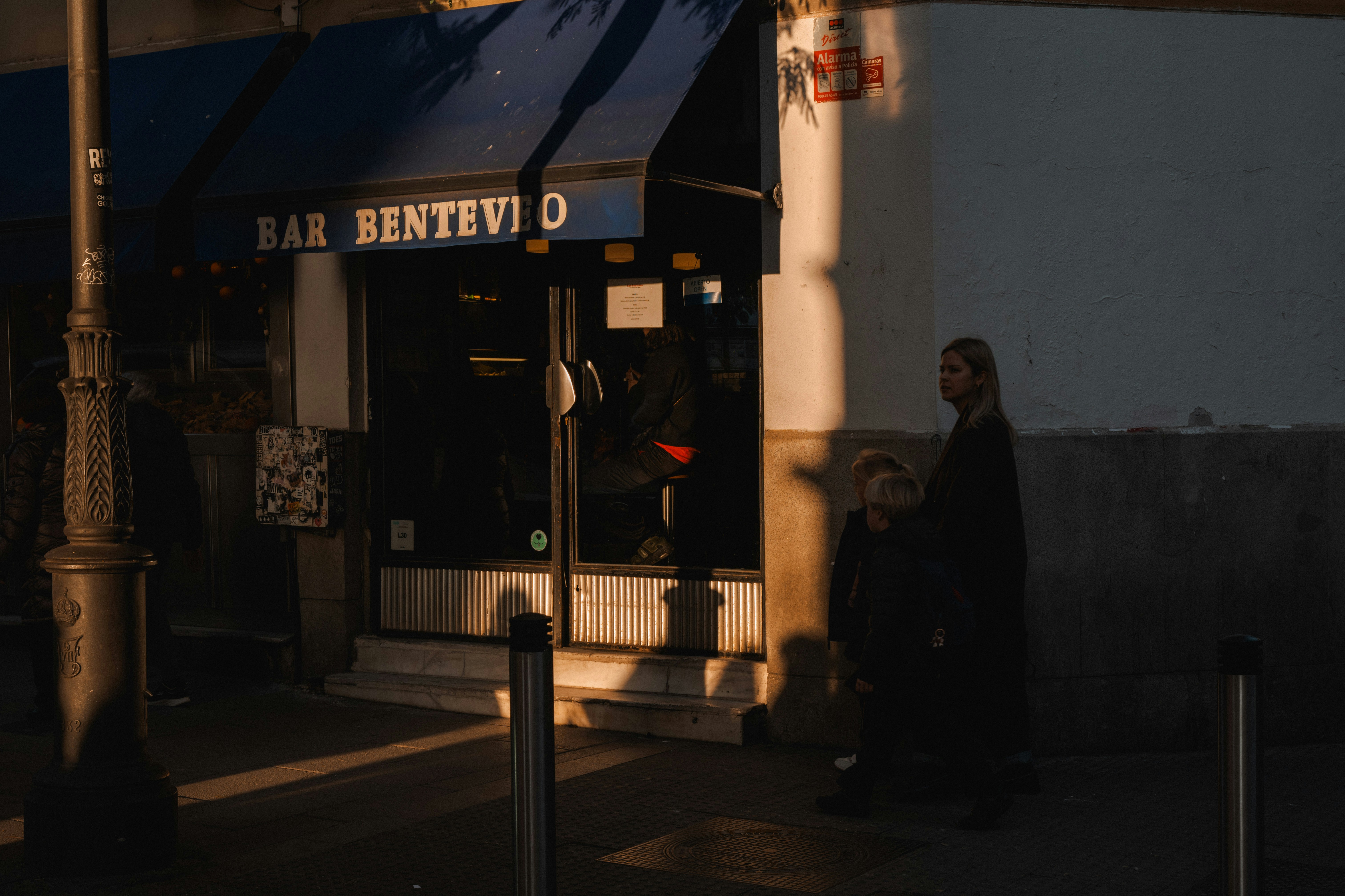 Muted Neon Quiet: A Streetcorner Bar at Dusk