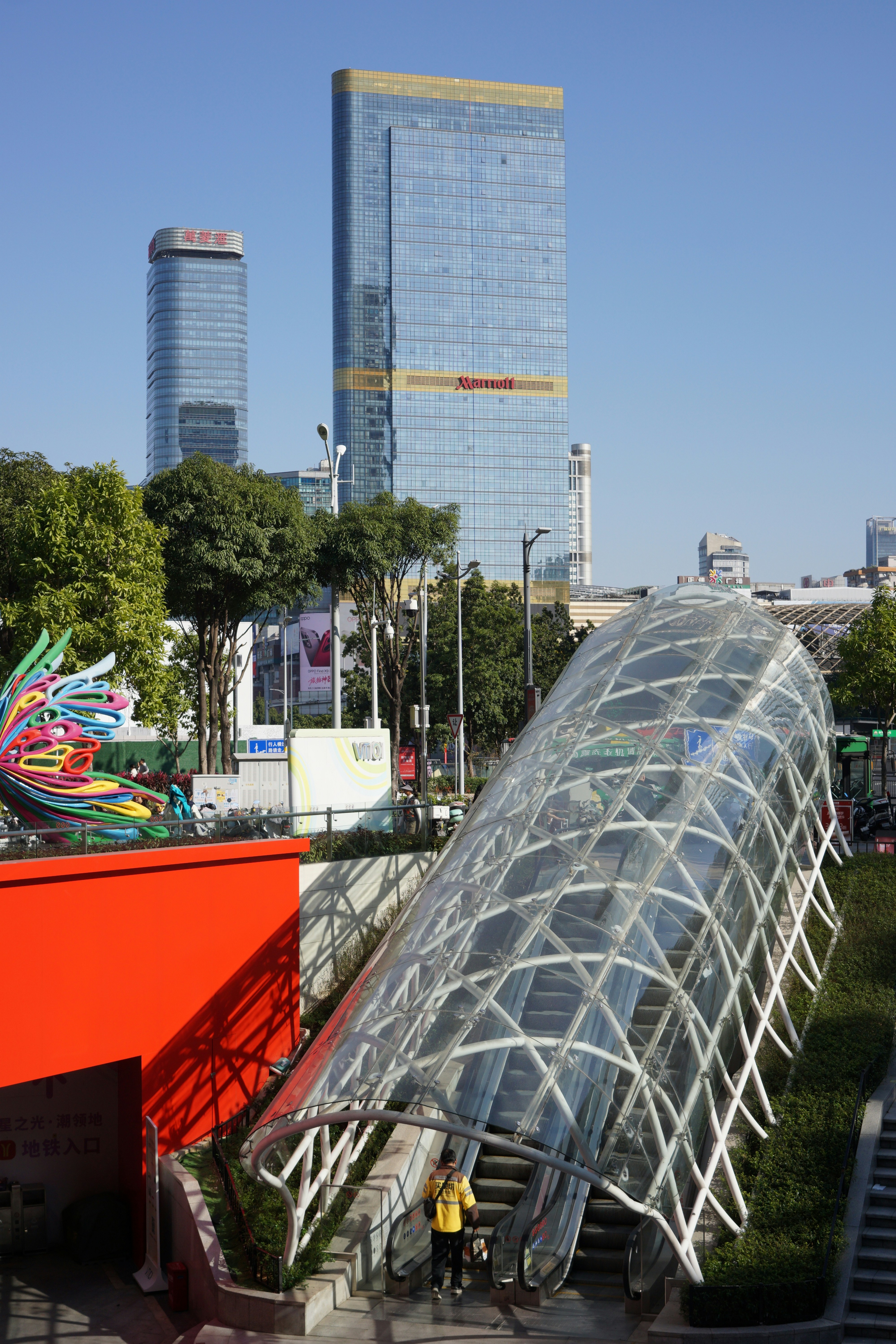 Skylines and Glass: A Modern Cityscape Converges with a Curved Atrium
