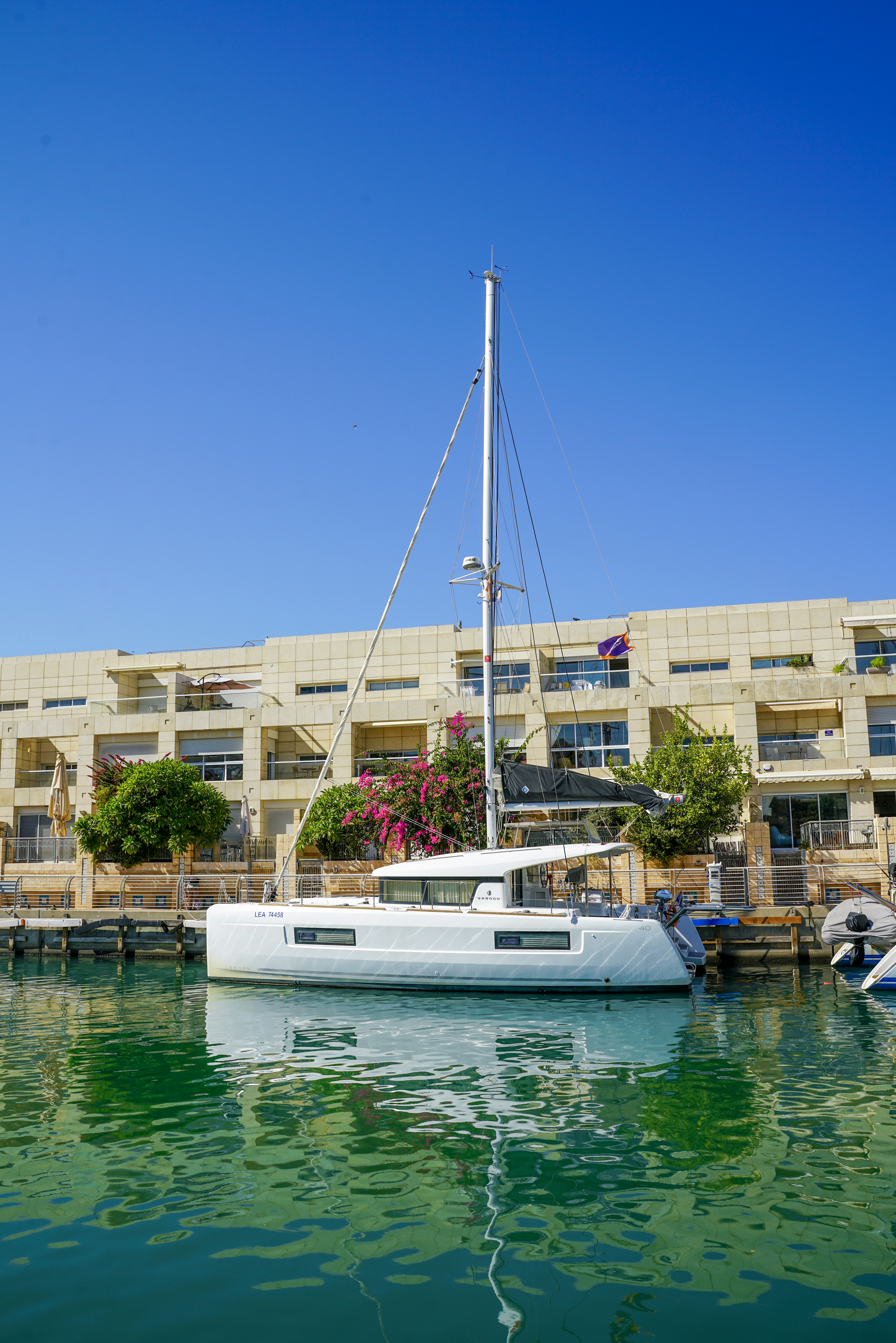 Sailboat Resting in a Sunny Harbor Courtyard