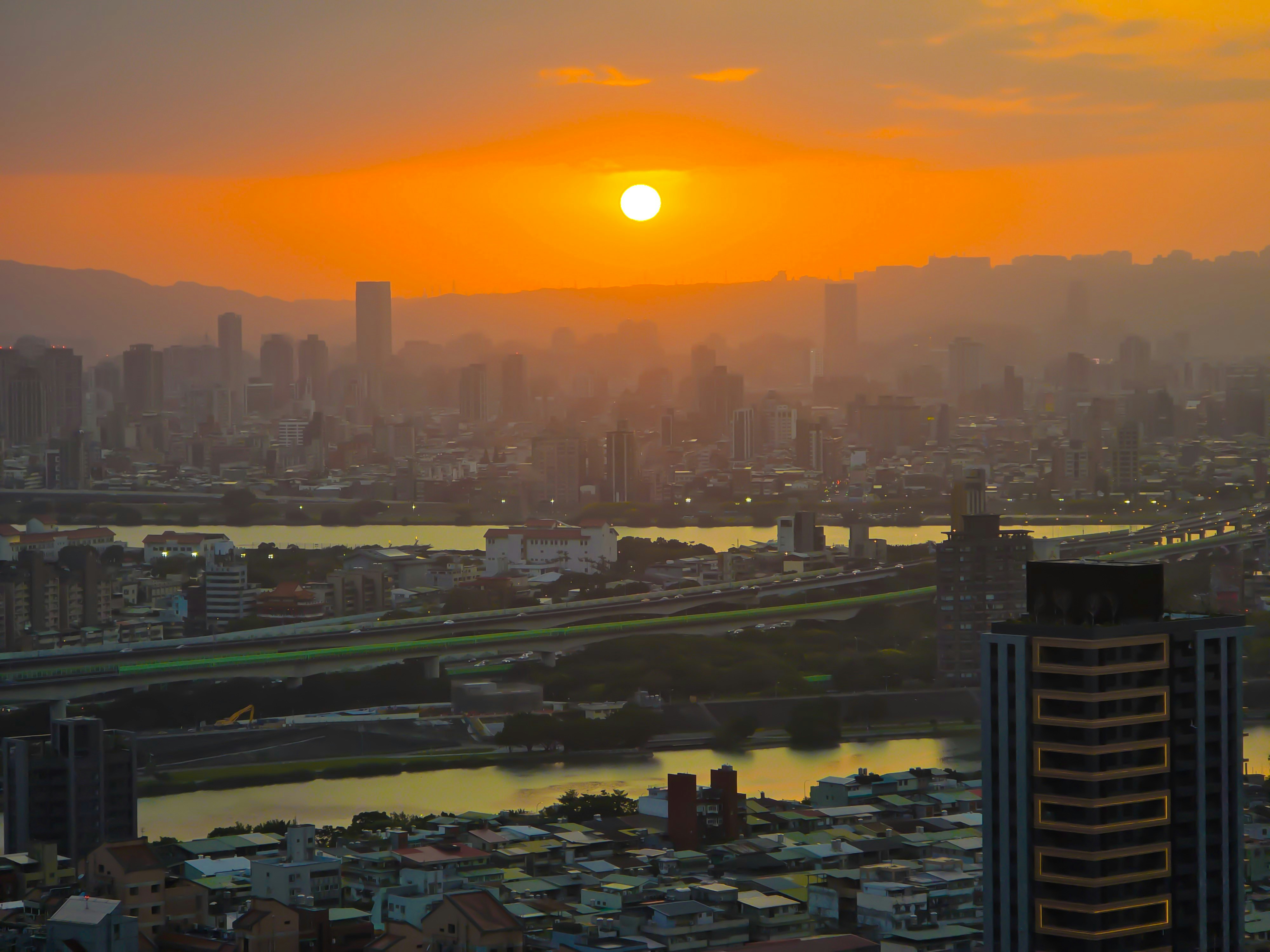 City at Dusk: Golden Sun Over the River Quadrants