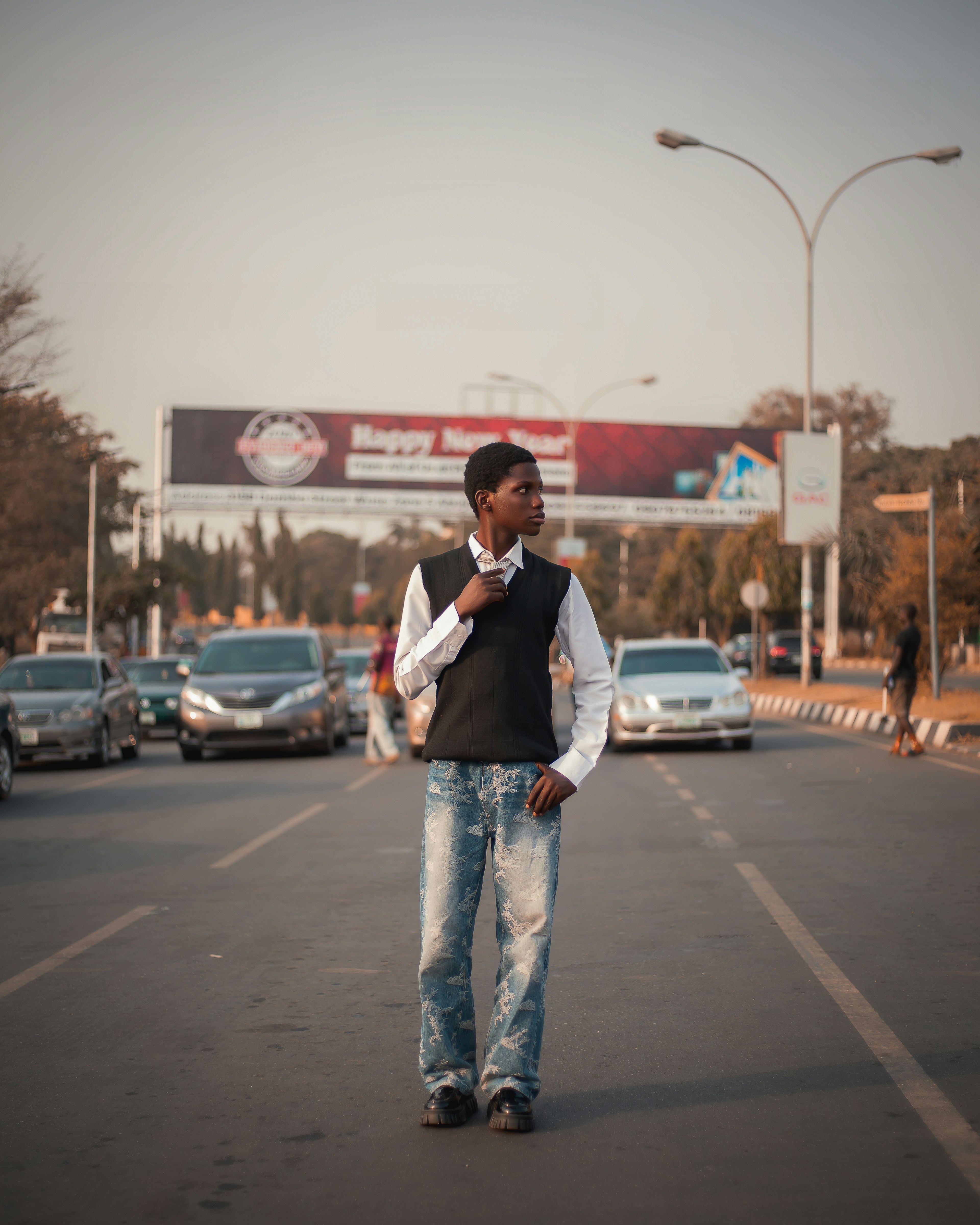 Street Portrait in the Evening Light: A Youth Stages a Moment